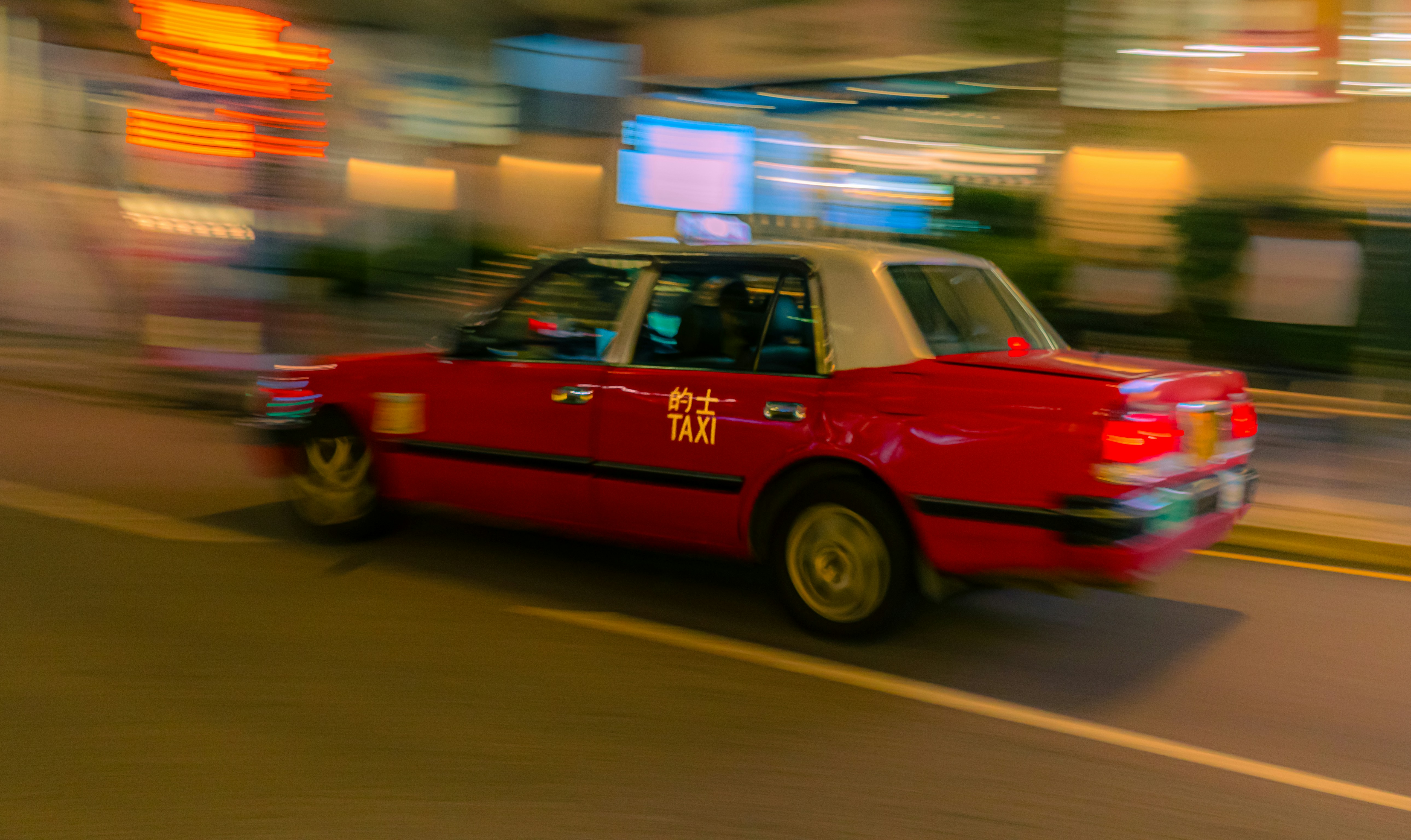 Neon Night Taxi in Motion