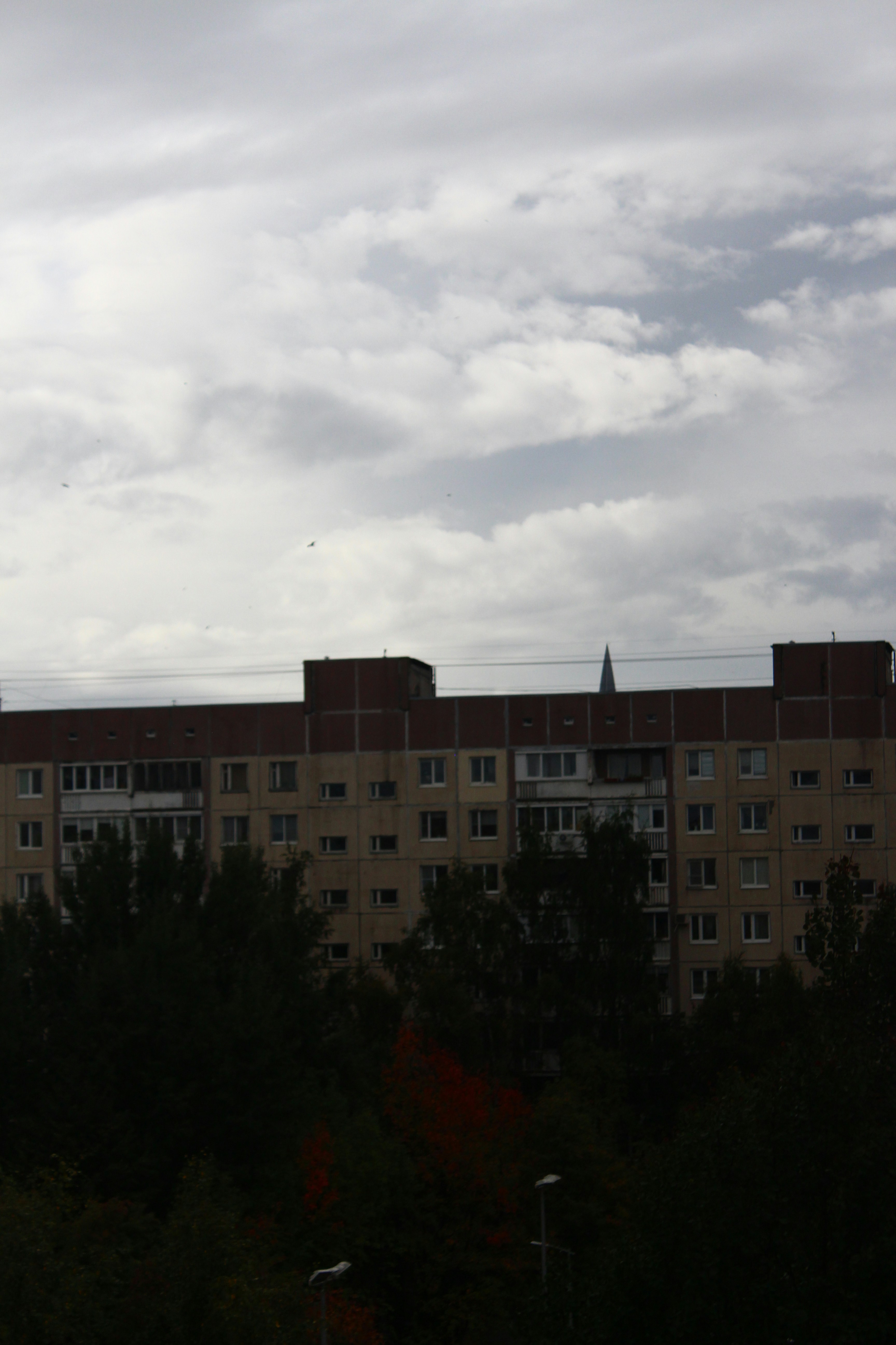 Urban silhouette under a cloudy sky