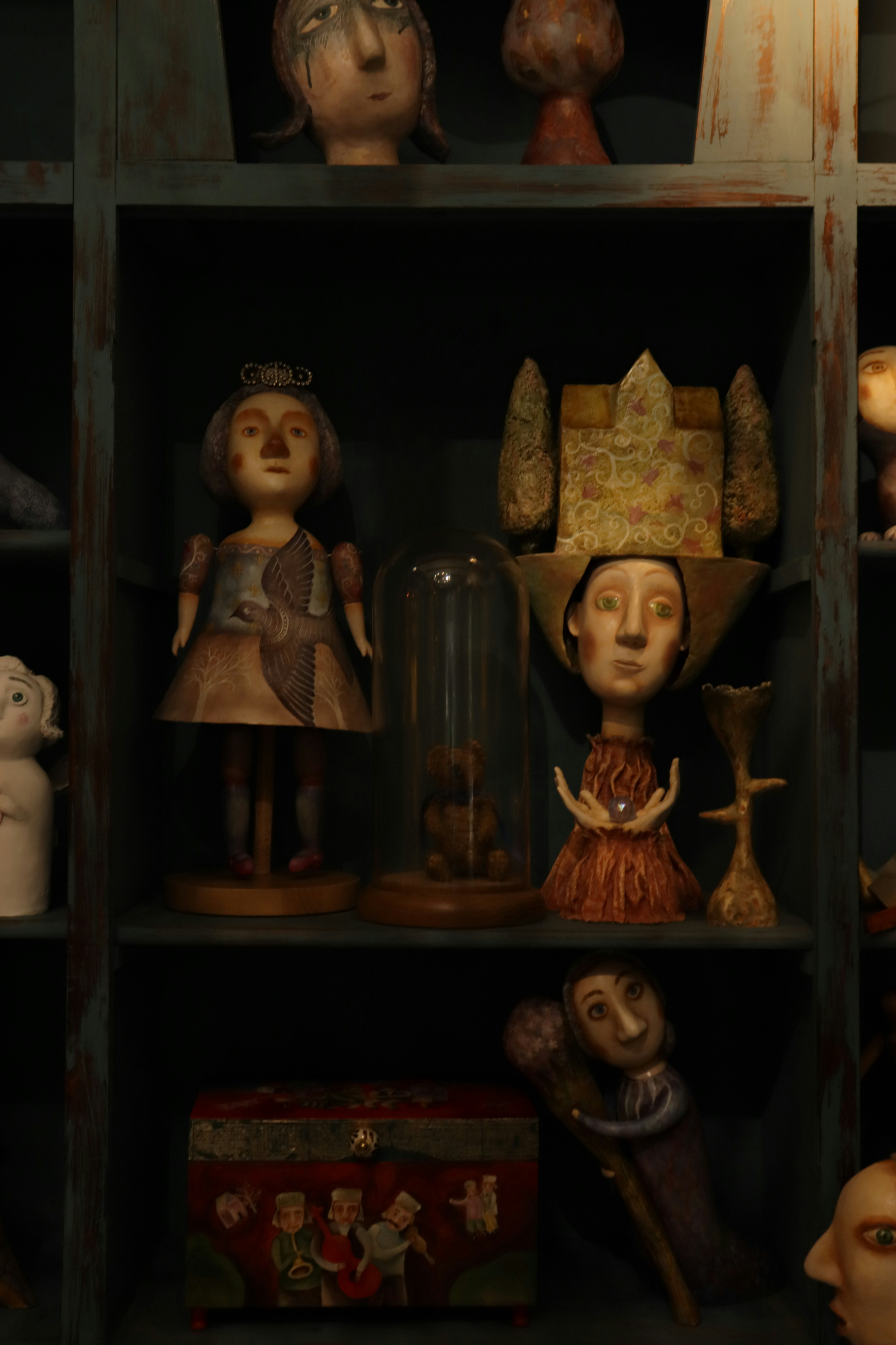 Dusty Shelf of Whimsy: A Quiet Assembly of Painted Figures