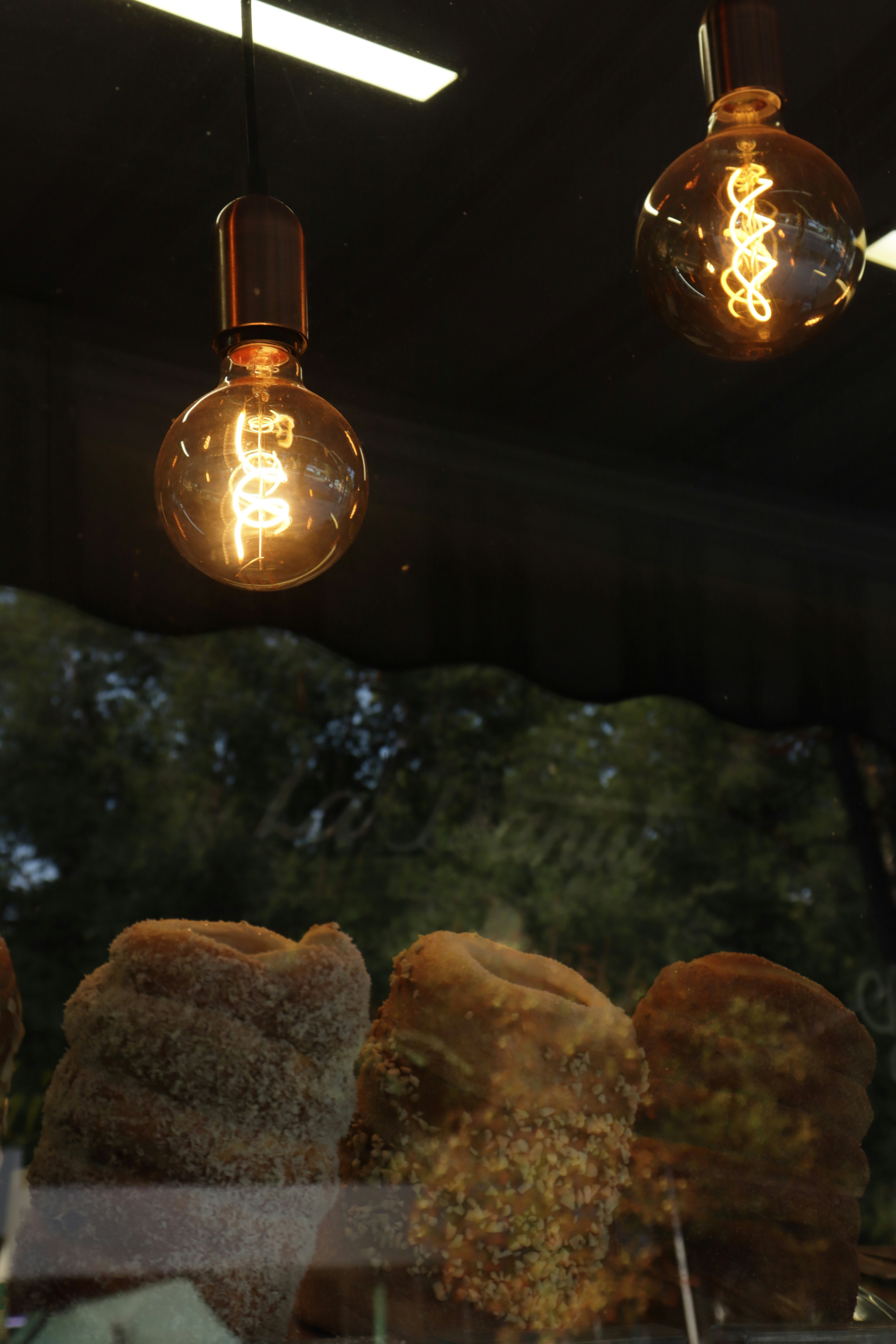 Glowing Orbs Over a Pastry Display