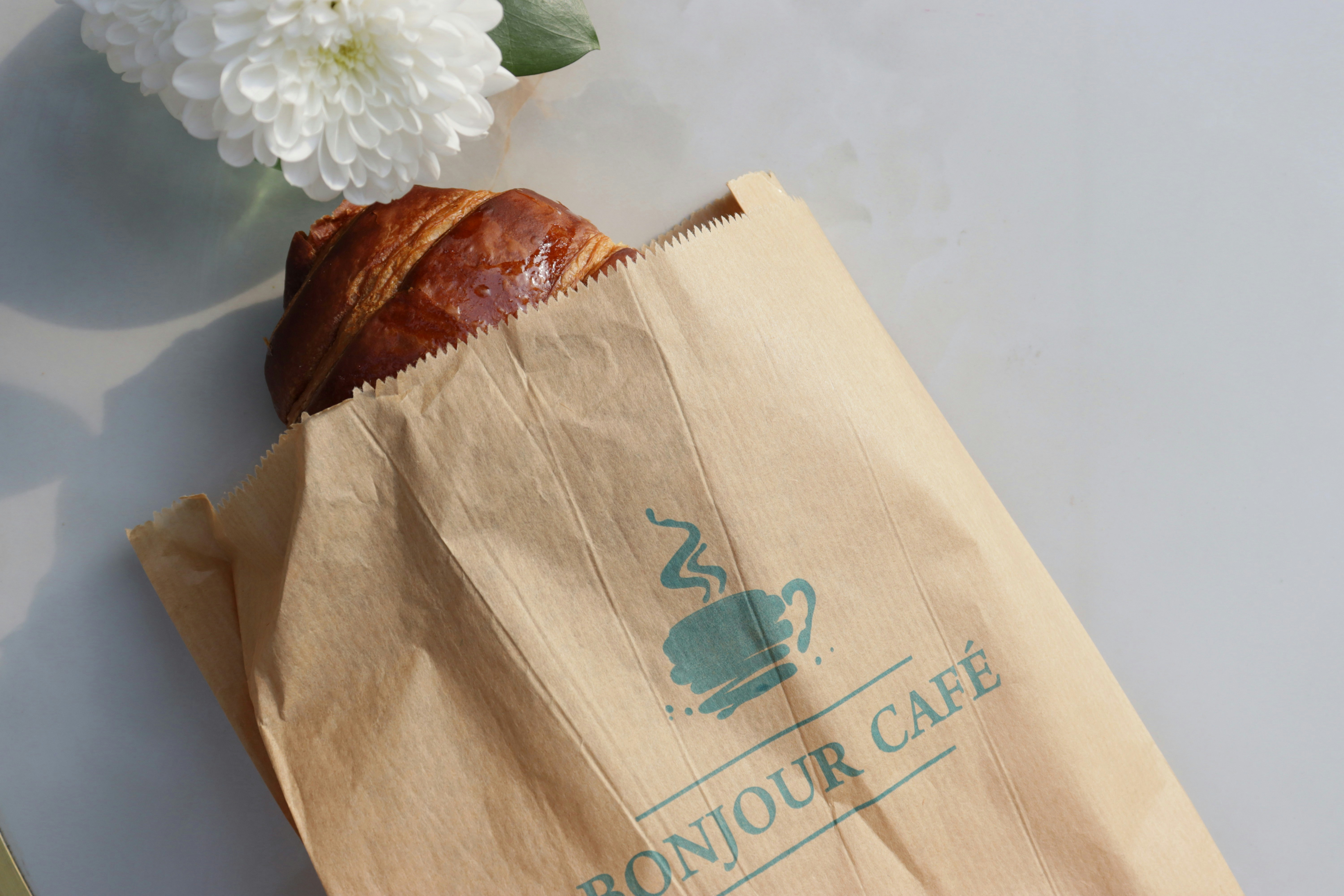 Crinkled Paper Bag Teasing a Pastry’s Promise