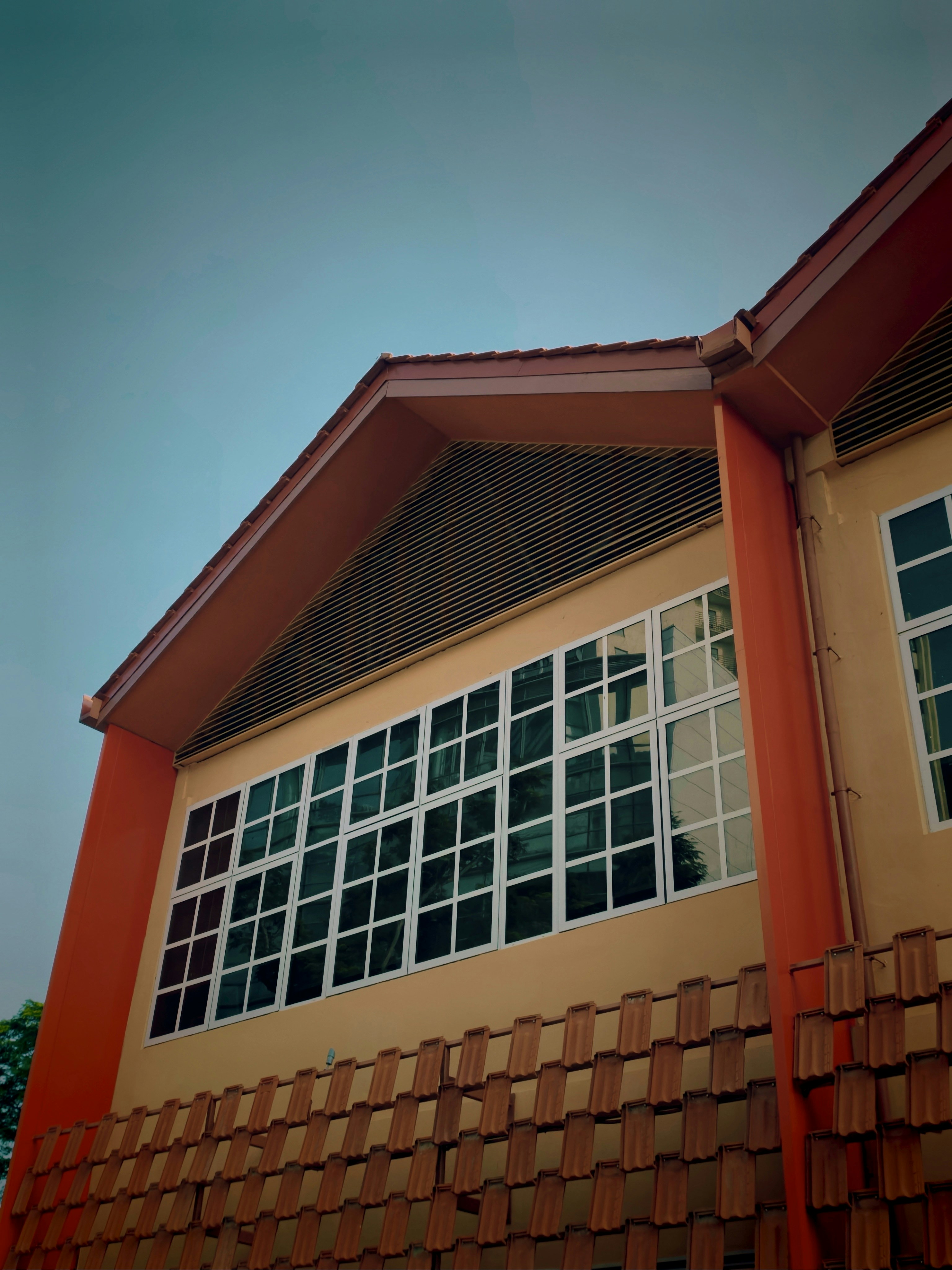 Architectural Portrait: The Gable Framed by Warm Tiles
