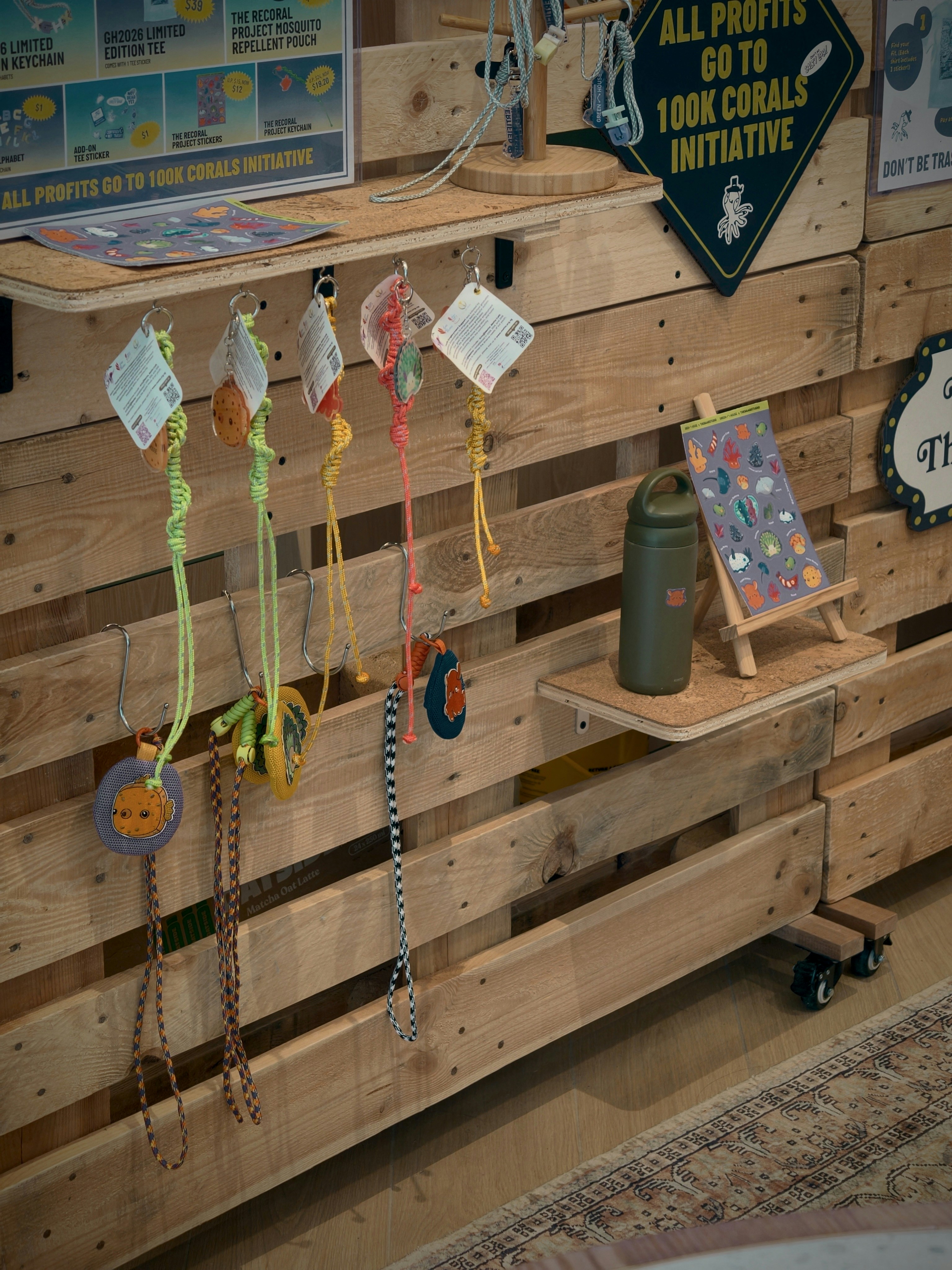 Whimsical Market Wall: Colors, Tags, and a Green Flask on Wood