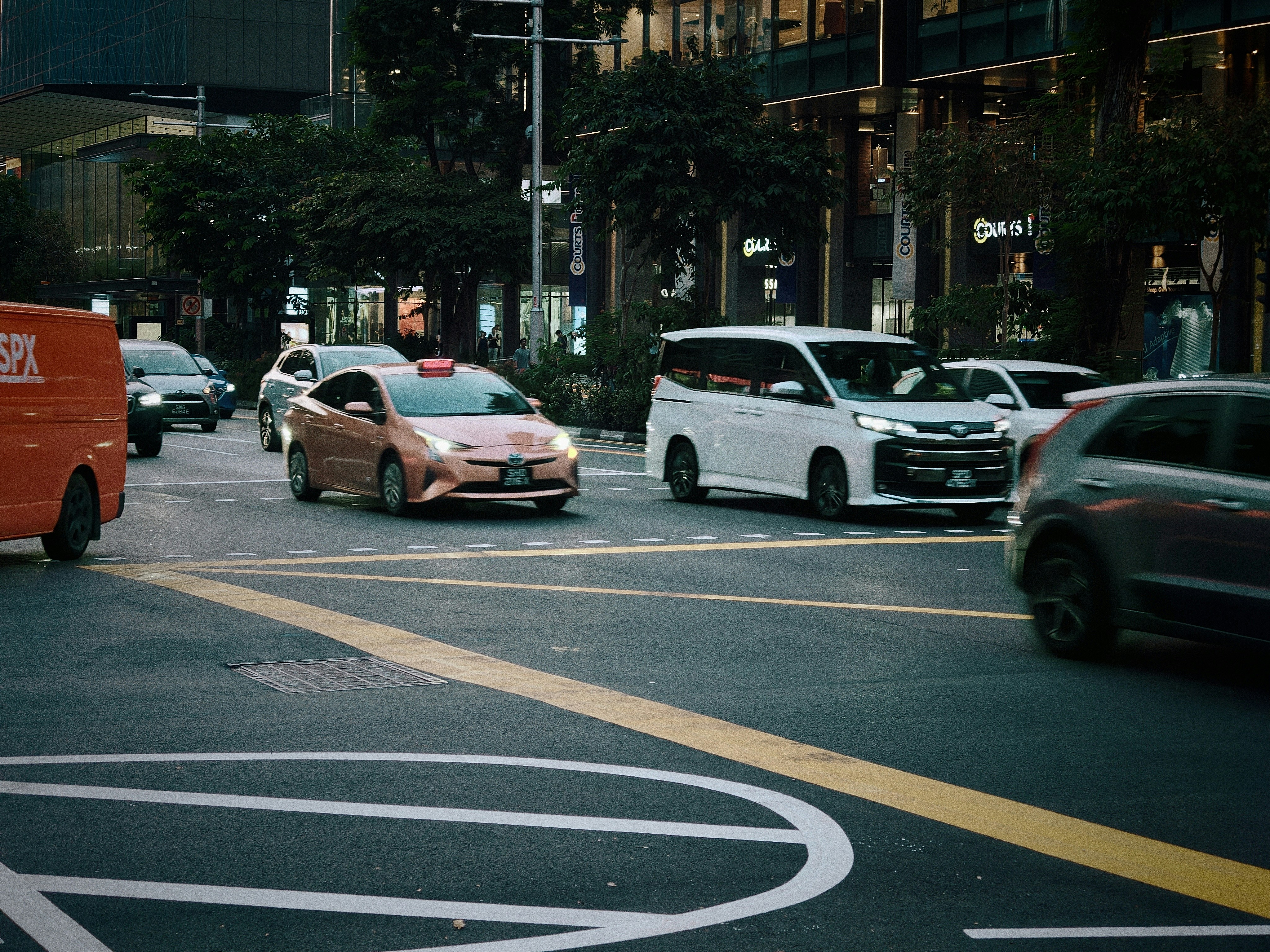 Cross-Curban Motion: Cars in a Busy Intersection