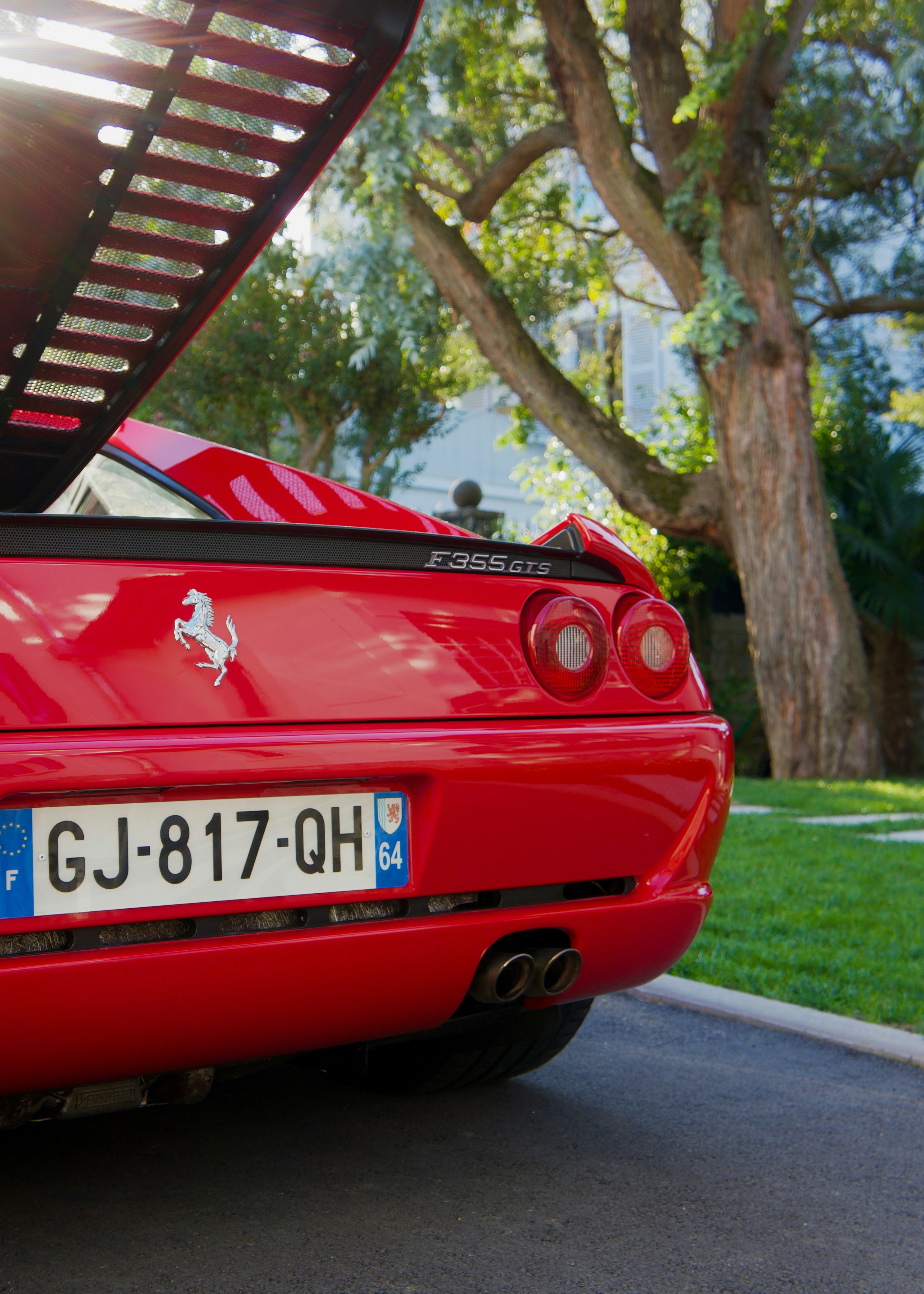 Red Ferrari Rear: A Sunset of Curves and Shine