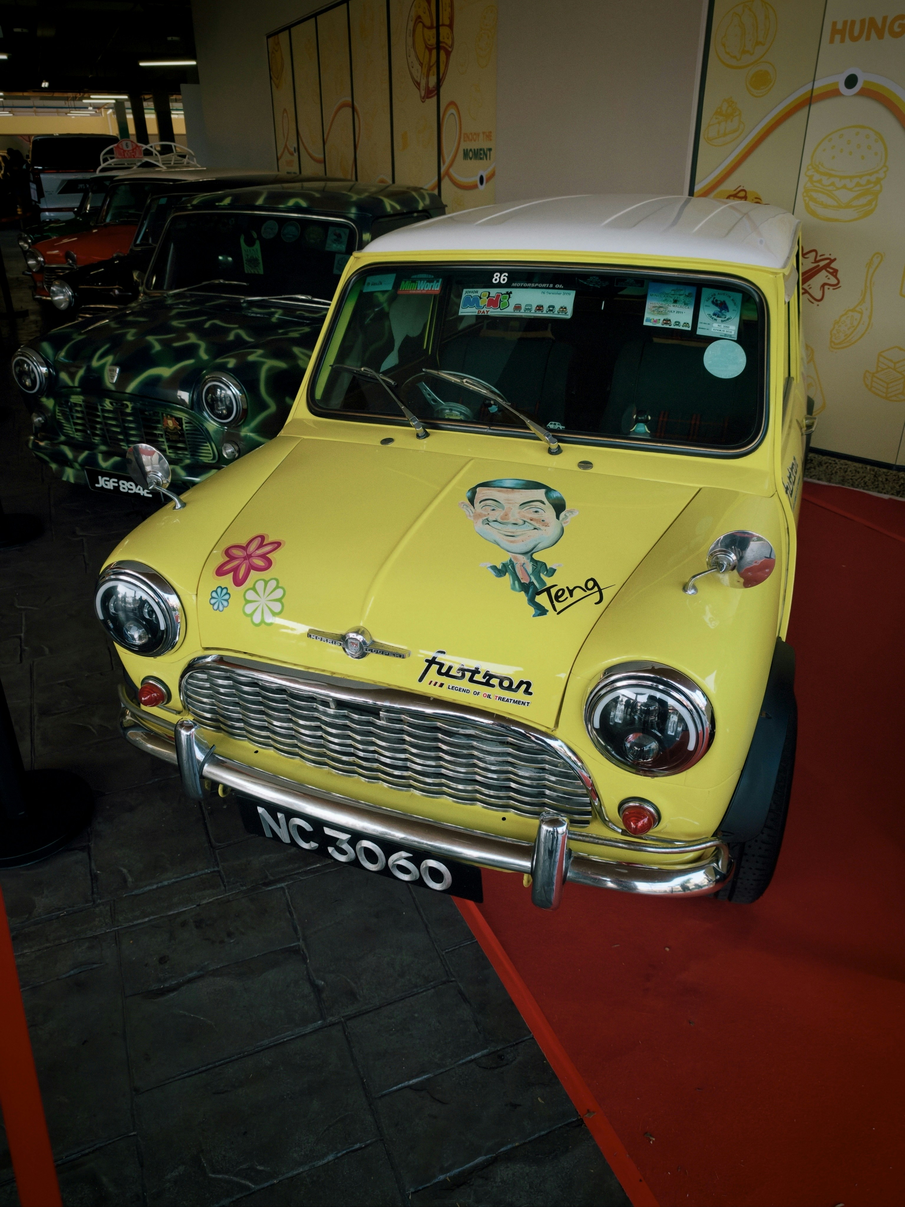 Yellow Retro Taxi: Front-Quarter Glare and Carved Graphics