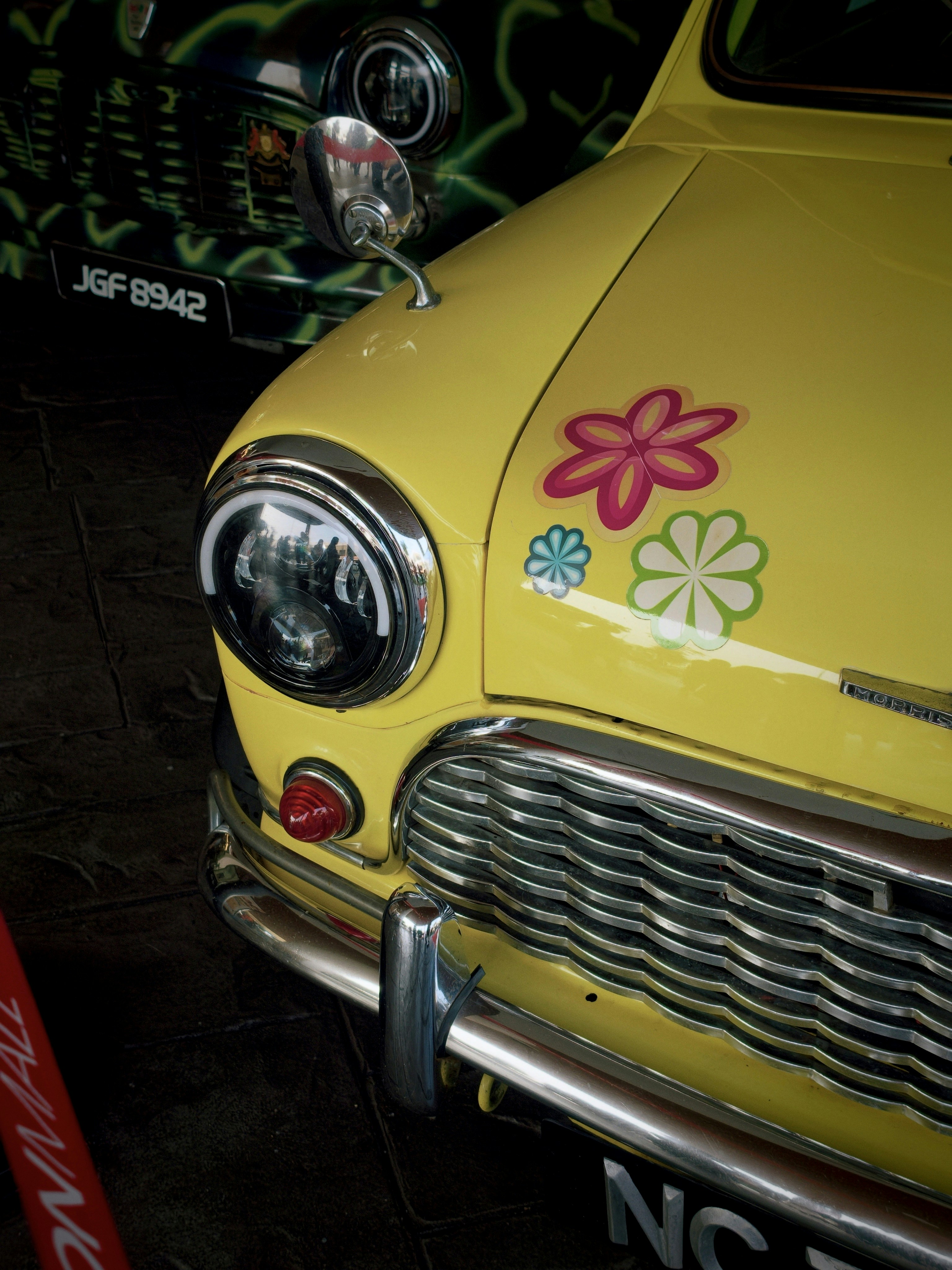 Sunny Hibiscus: A Retro Yellow Ride with Flower Decals