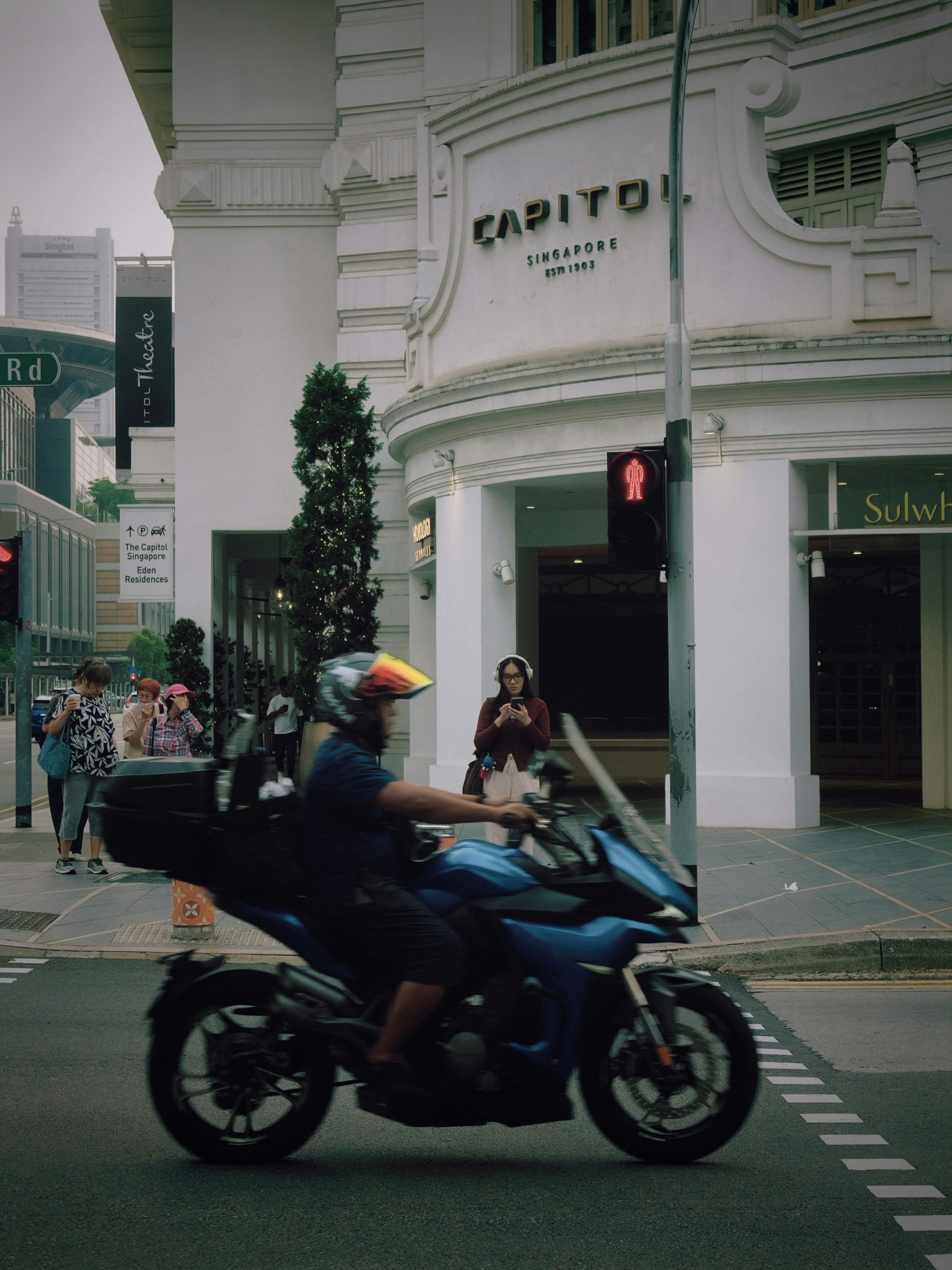 Street Pulse: Motorcycle in motion past the Capitol Theatre