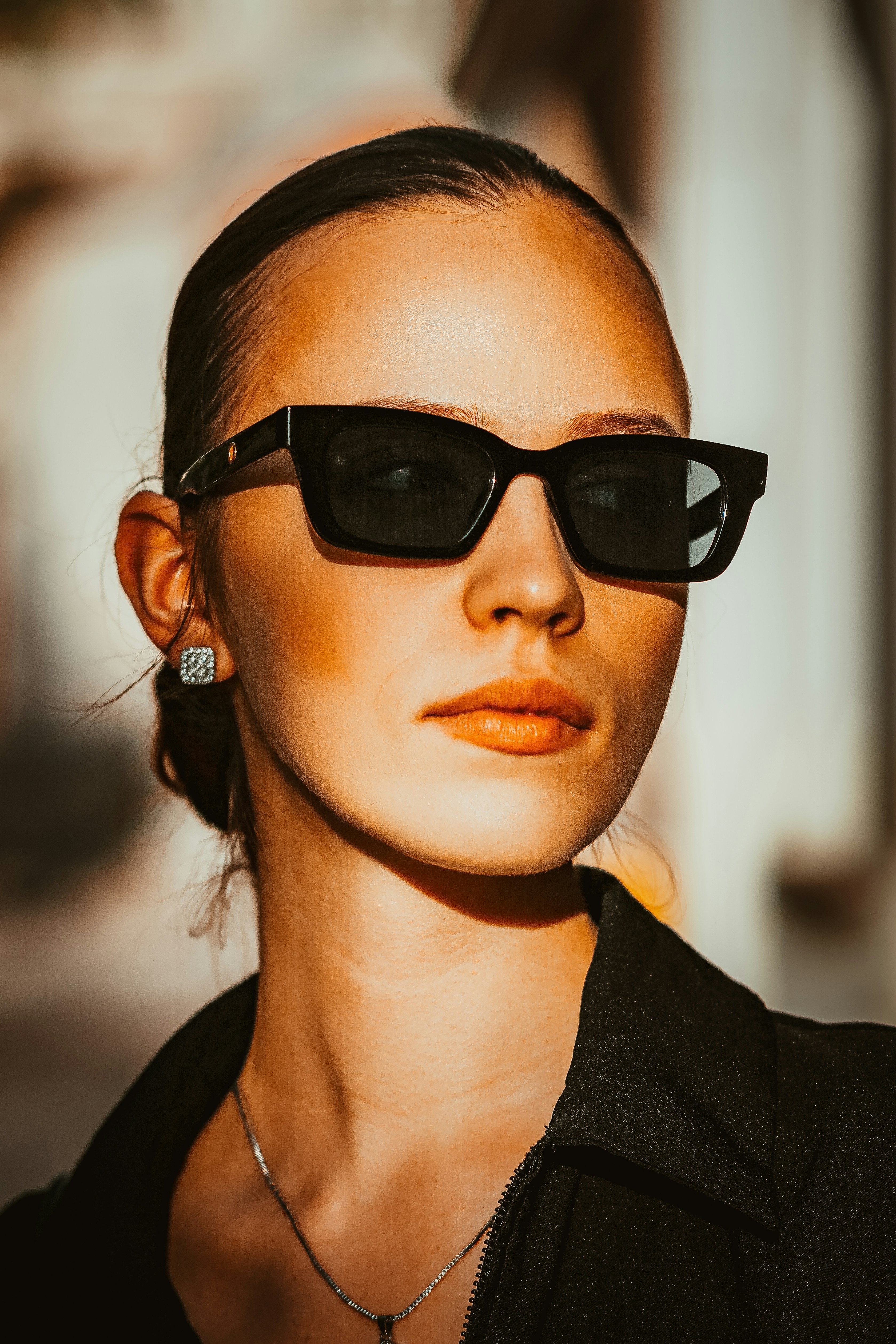 Shadowed Confidence: Portrait in Sunlit Streetwear