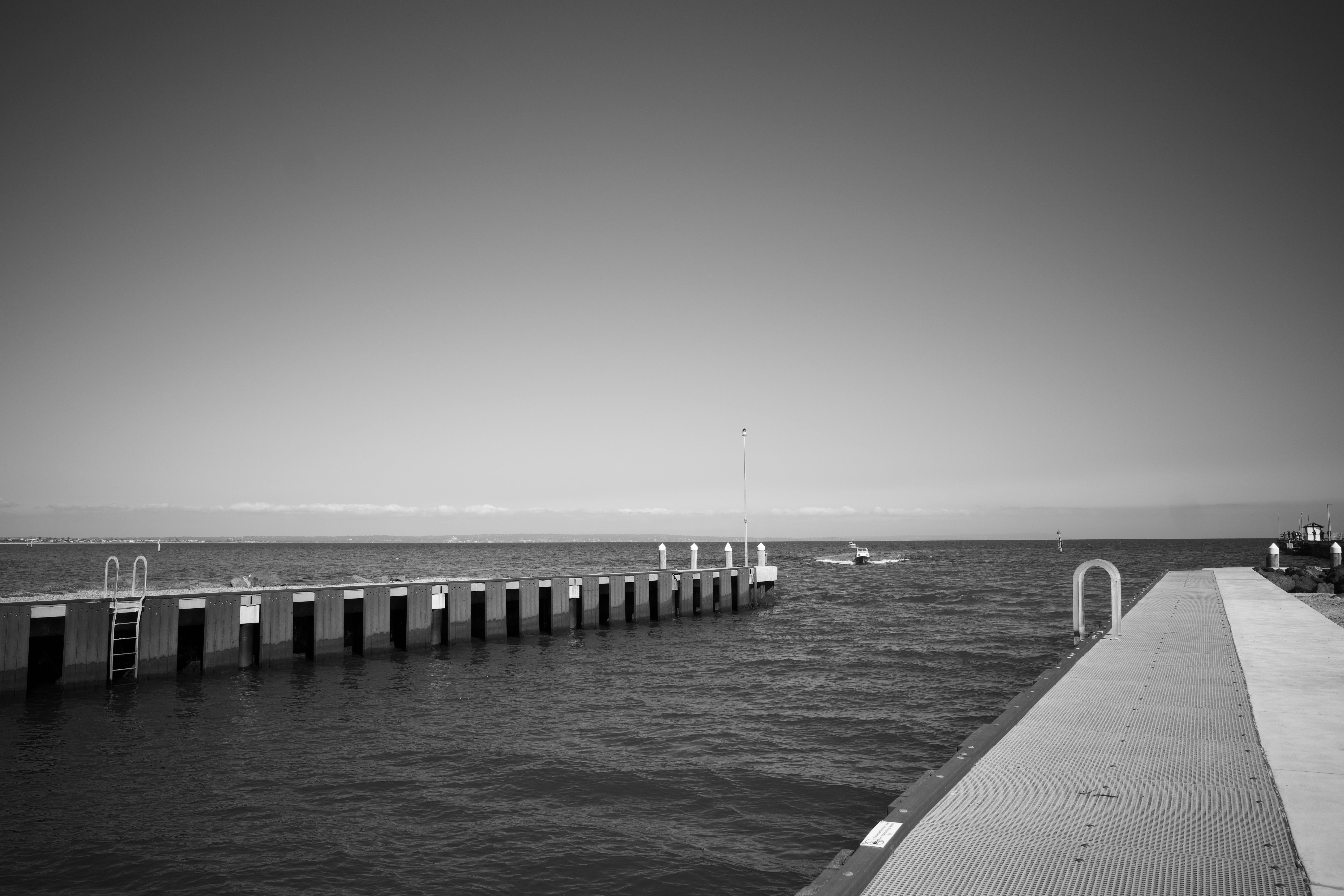 Pier Horizons: Quiet Sea at Dusk