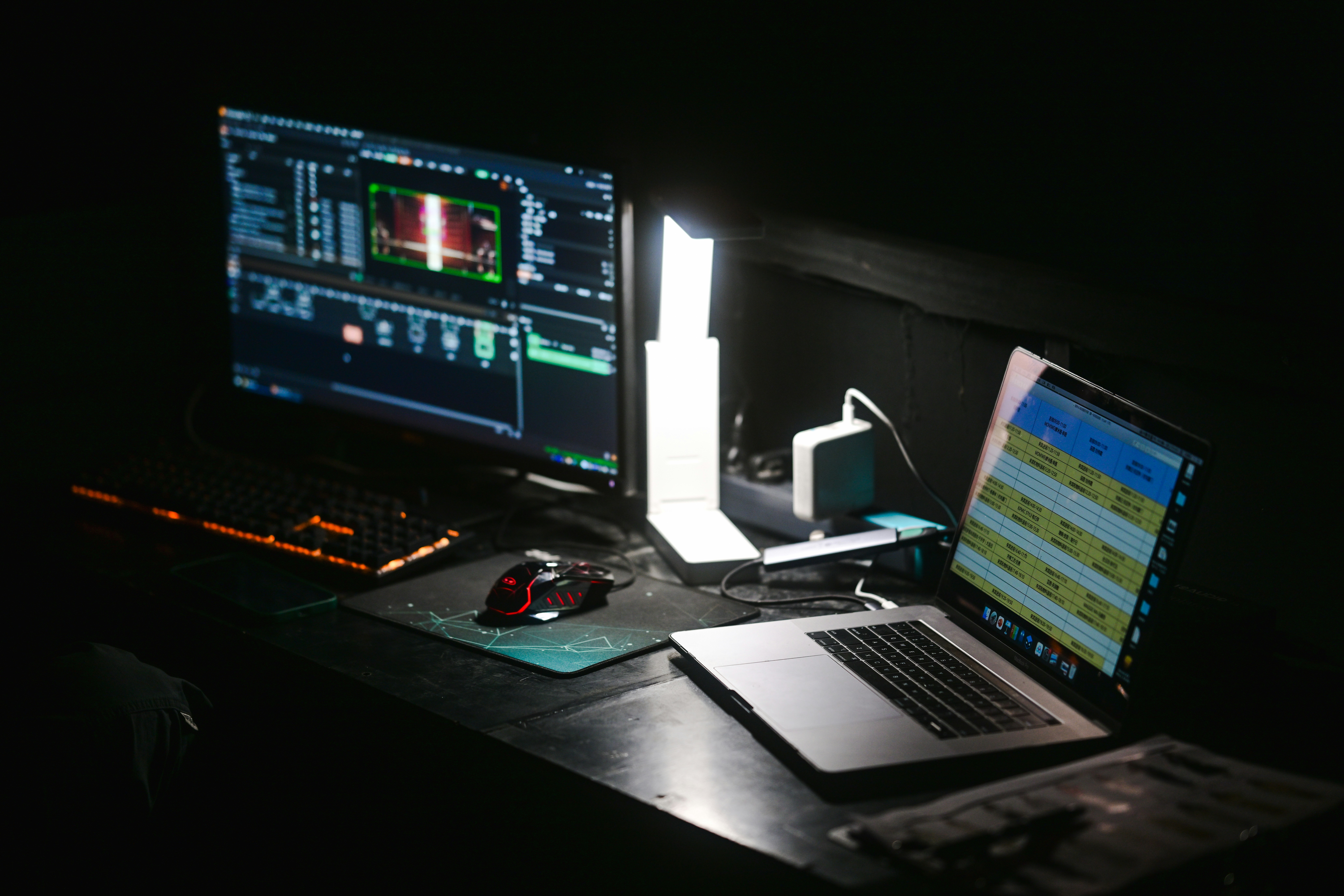 Night Lab: A Dual-Screen Editing Desk Surrounded by Backlit Gears