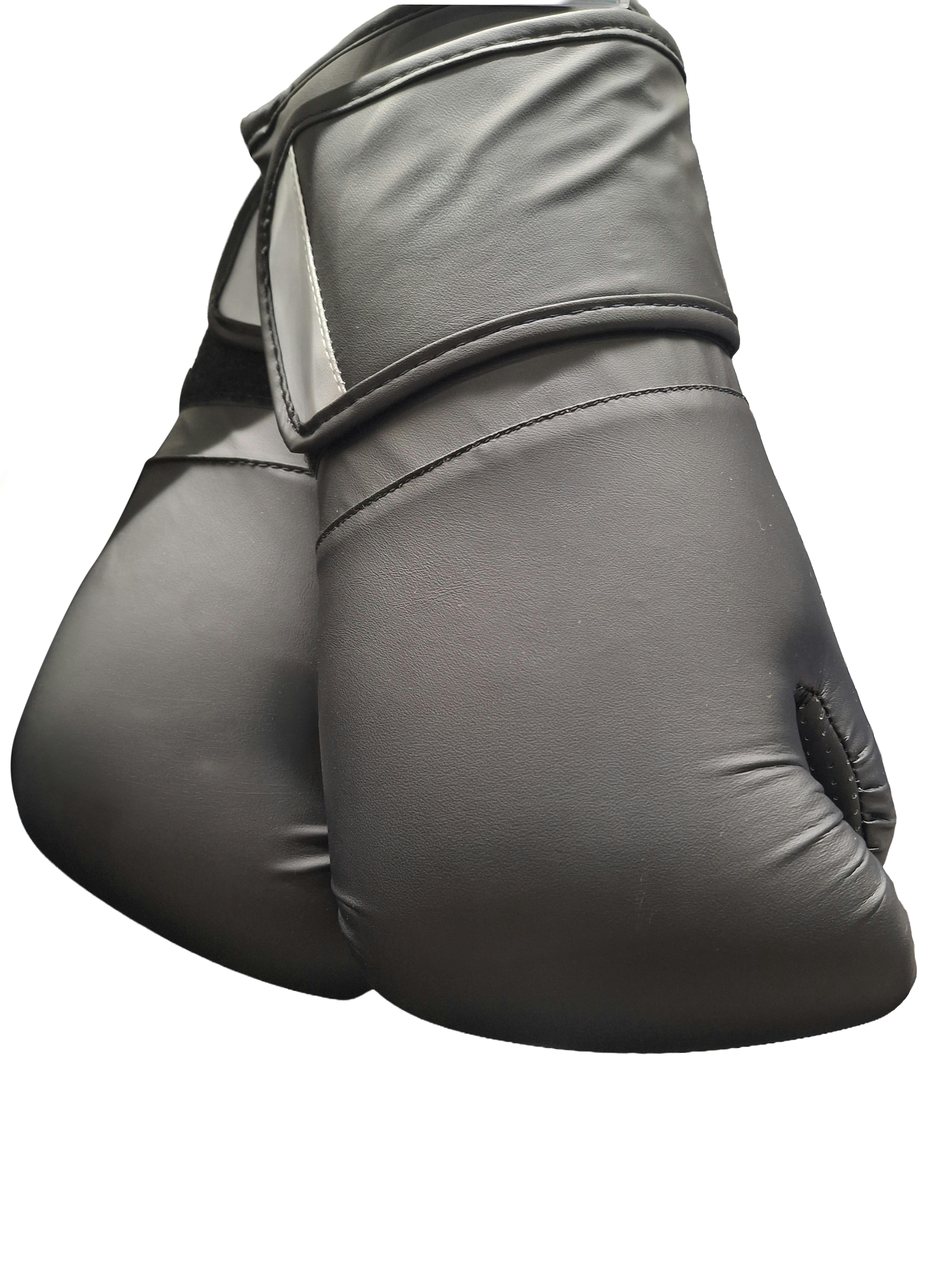 Silhouette of a Boxing Glove Duo in a Soft Studio Reveal