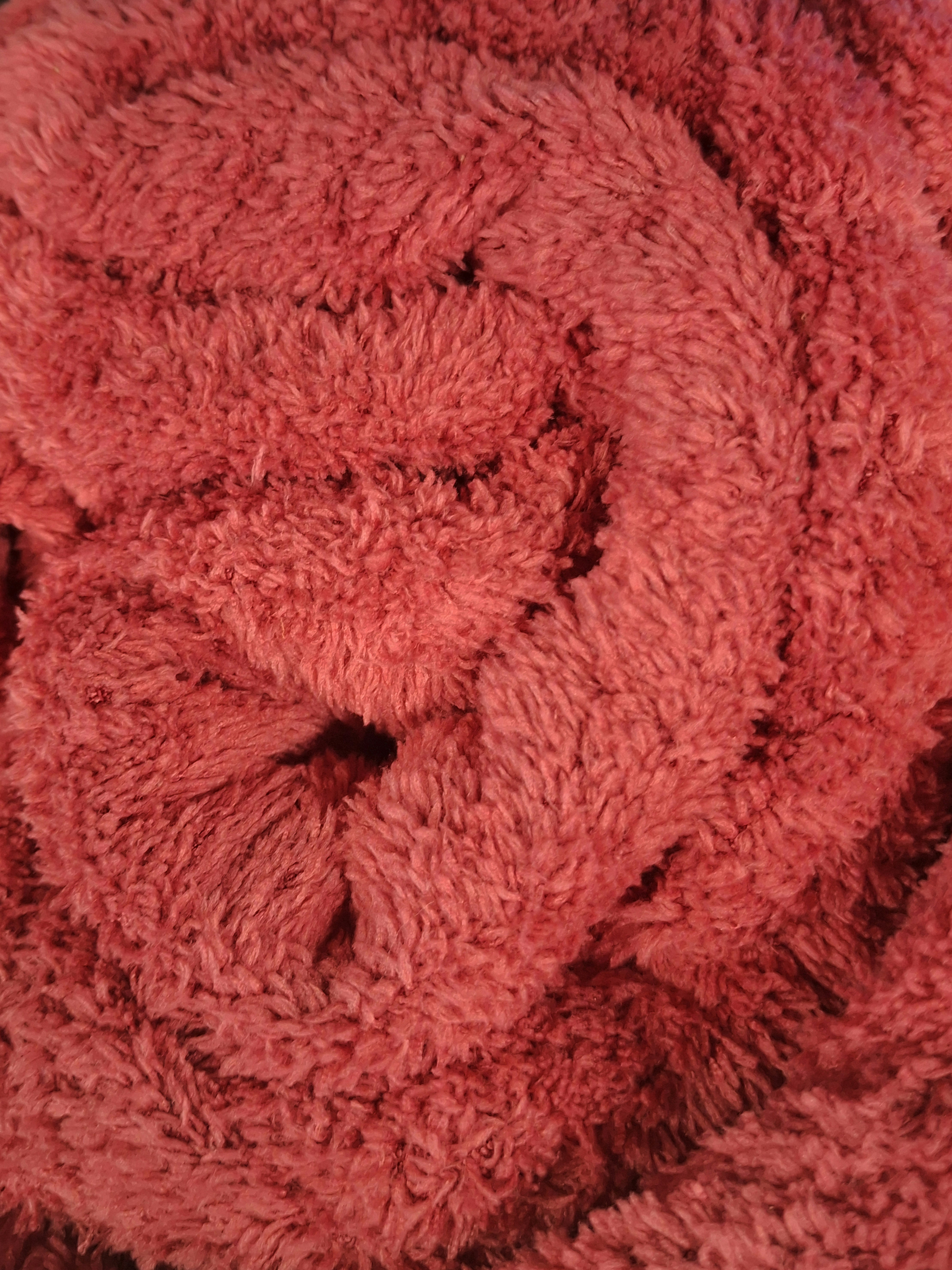 Coiled Velvet: A Macro Embrace of Red Plush Texture