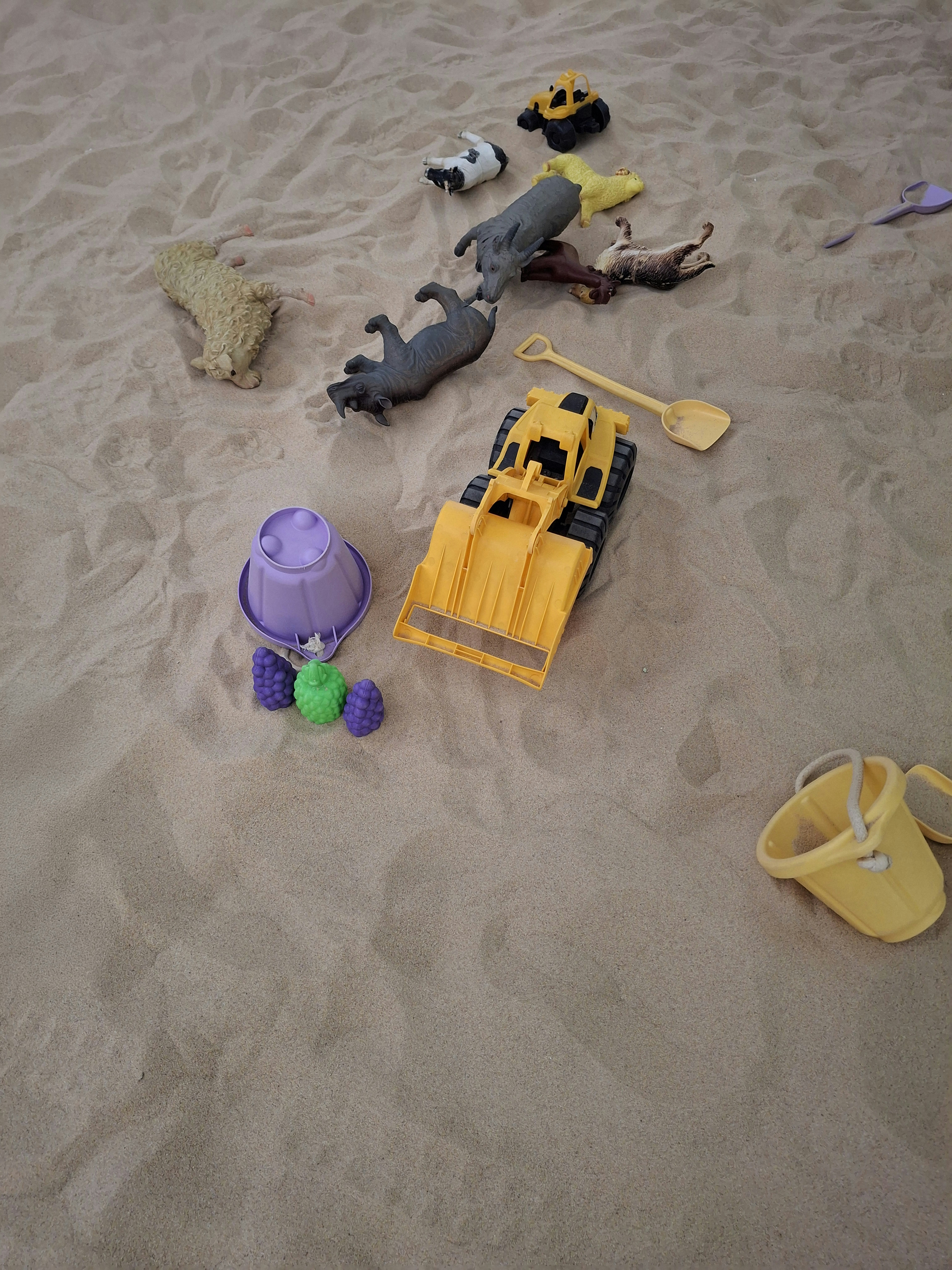 Yellow Construction Vehicle Parade on Sunlit Sandbox