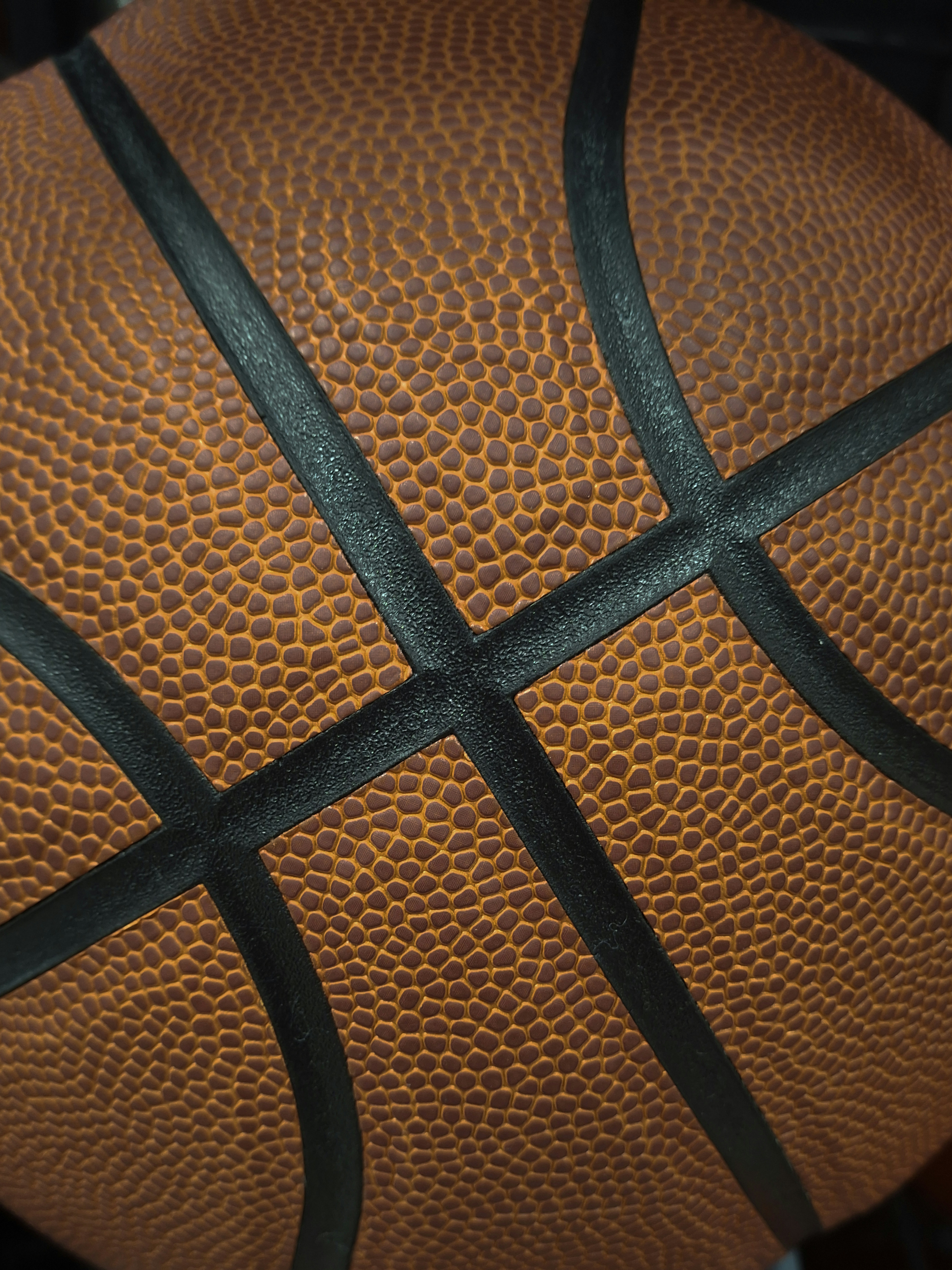 Textured basketball surface on display in a sports shop