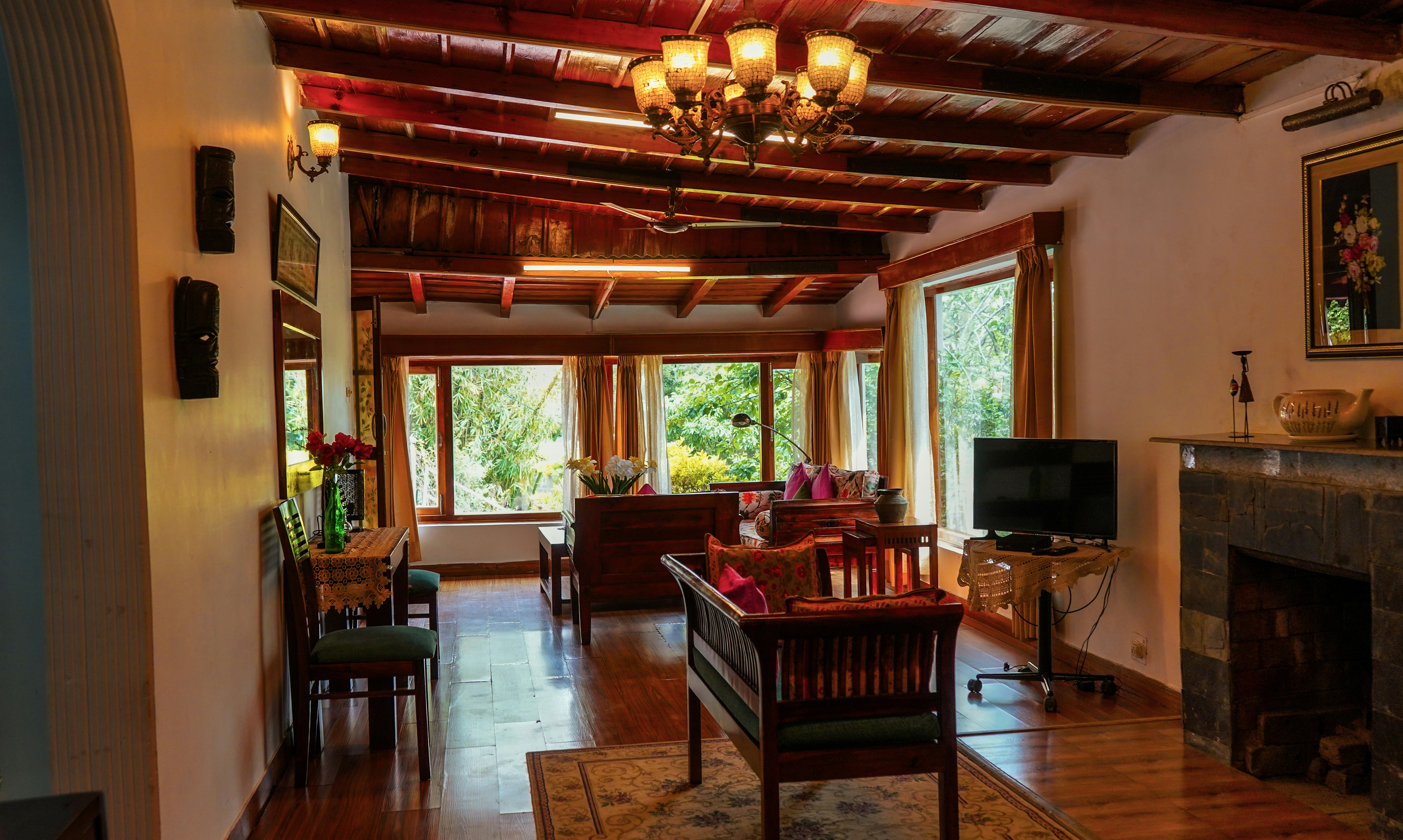 Sunlit Living Room with Garden View and Warm Woods
