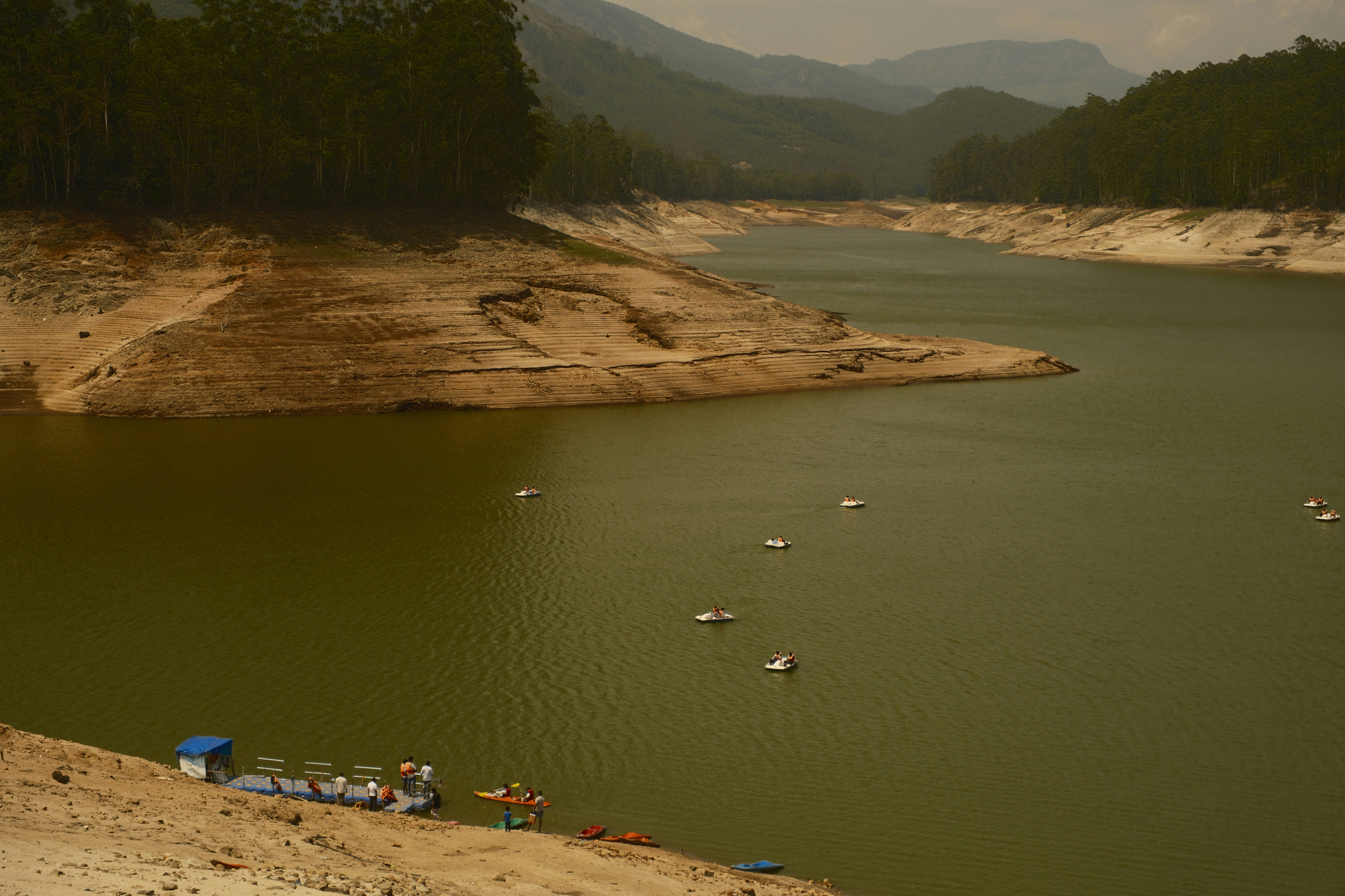 Quiet Reservoir Edge: Boats and Sandstone Curves