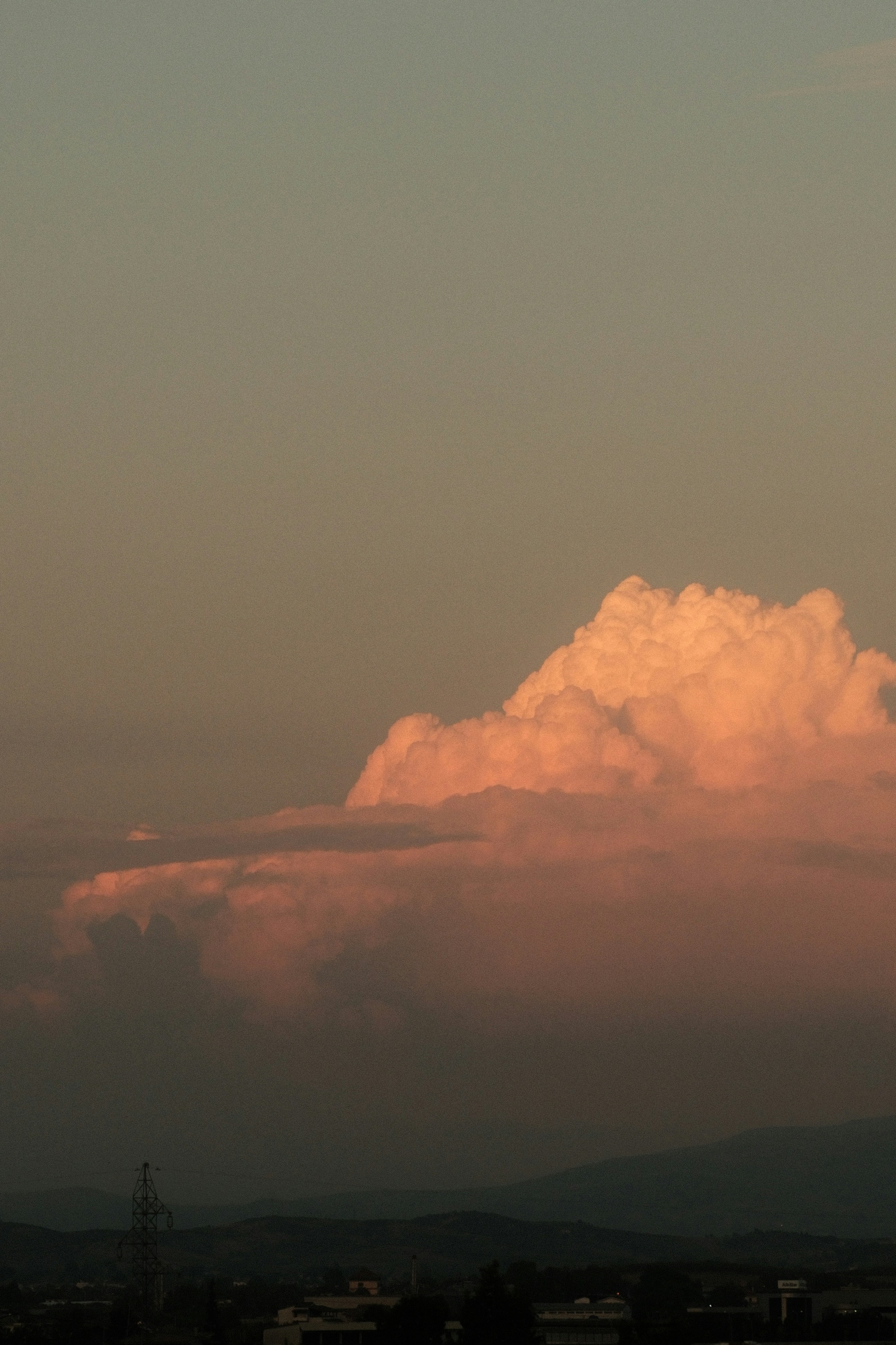Primal Clouds Over Quiet Hills at Dusk