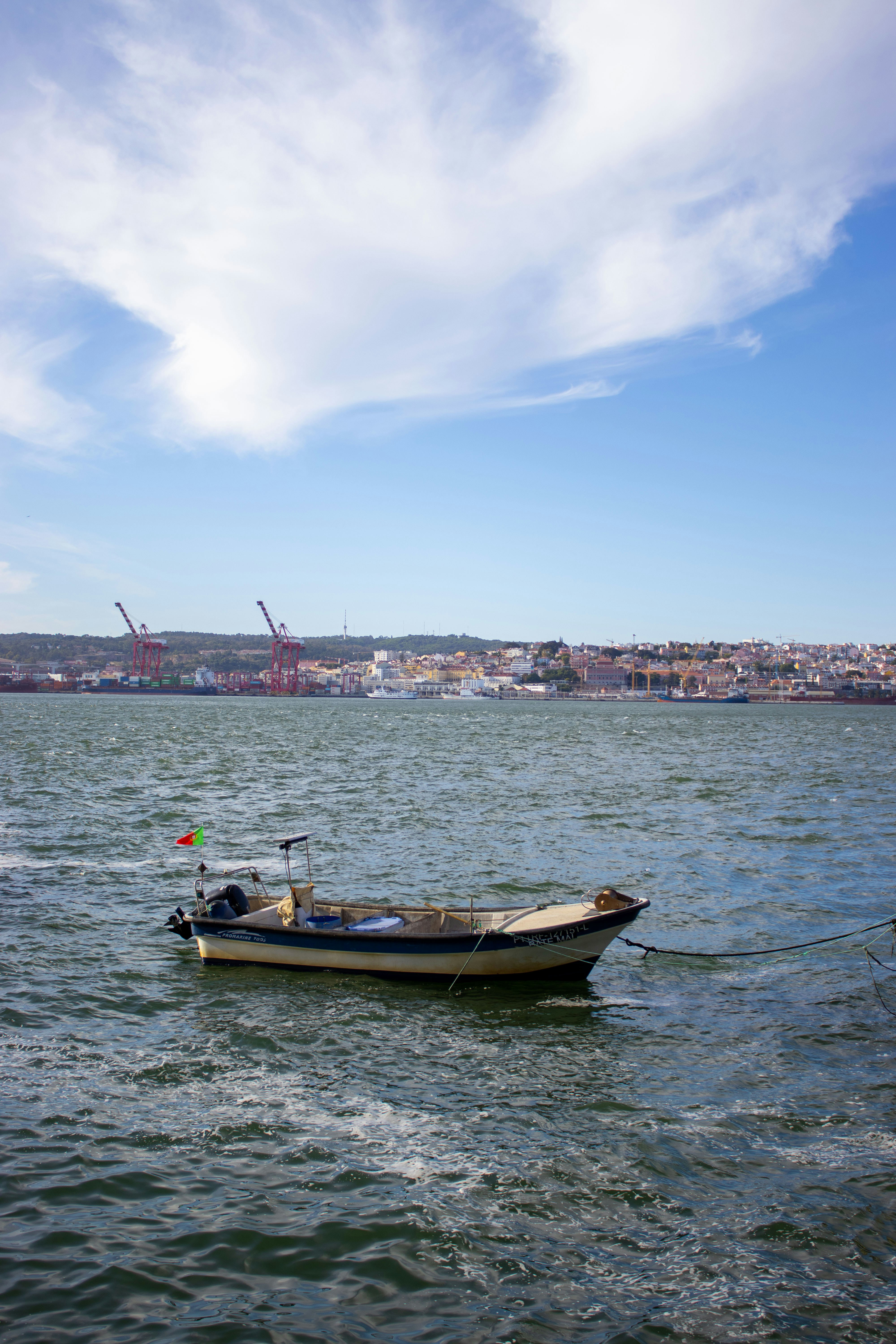 Boat at Sail: Quiet Waters and Distant Harbor
