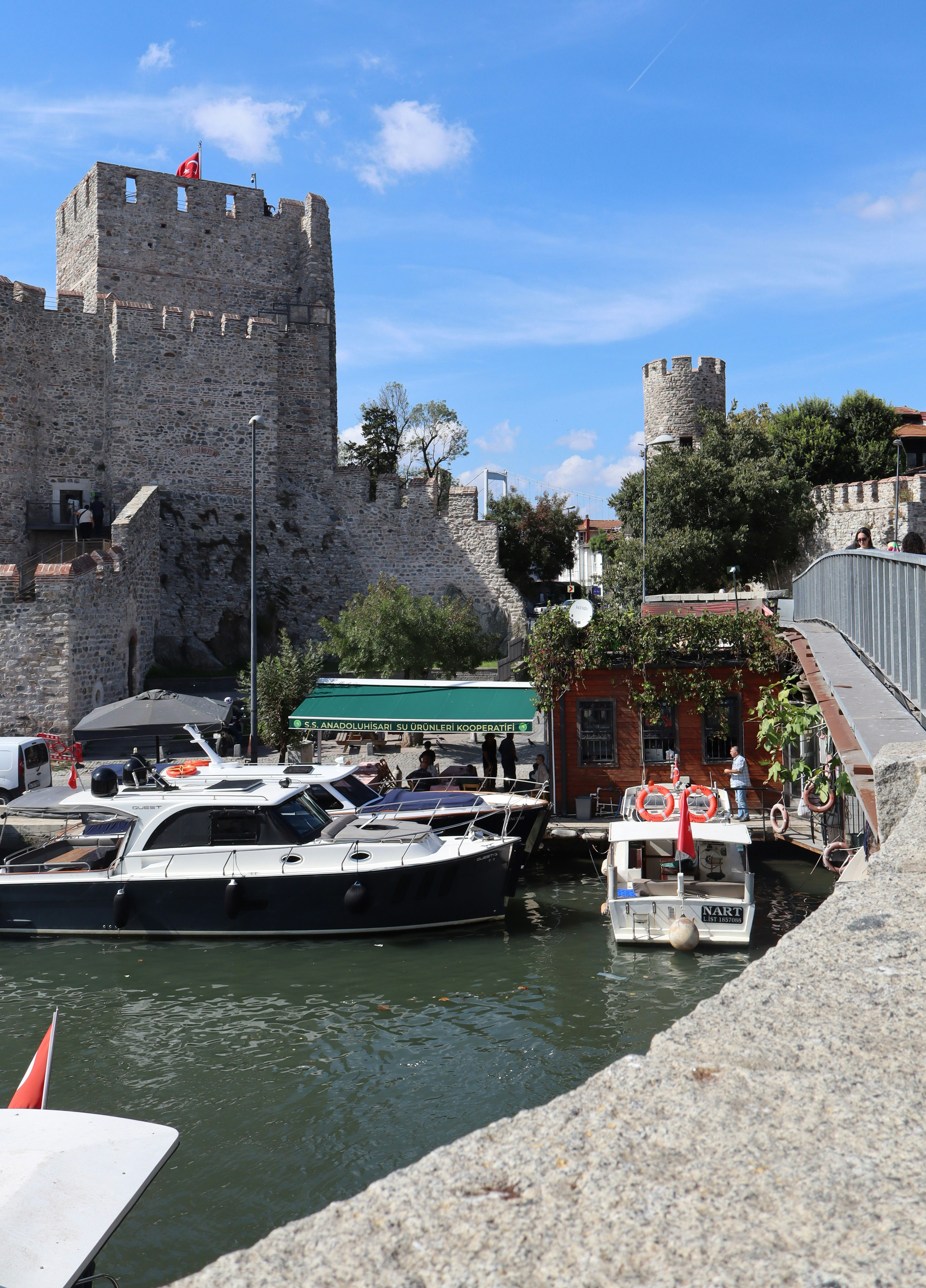 Castle Marina: Boats at the Gate Under a Blue Sky