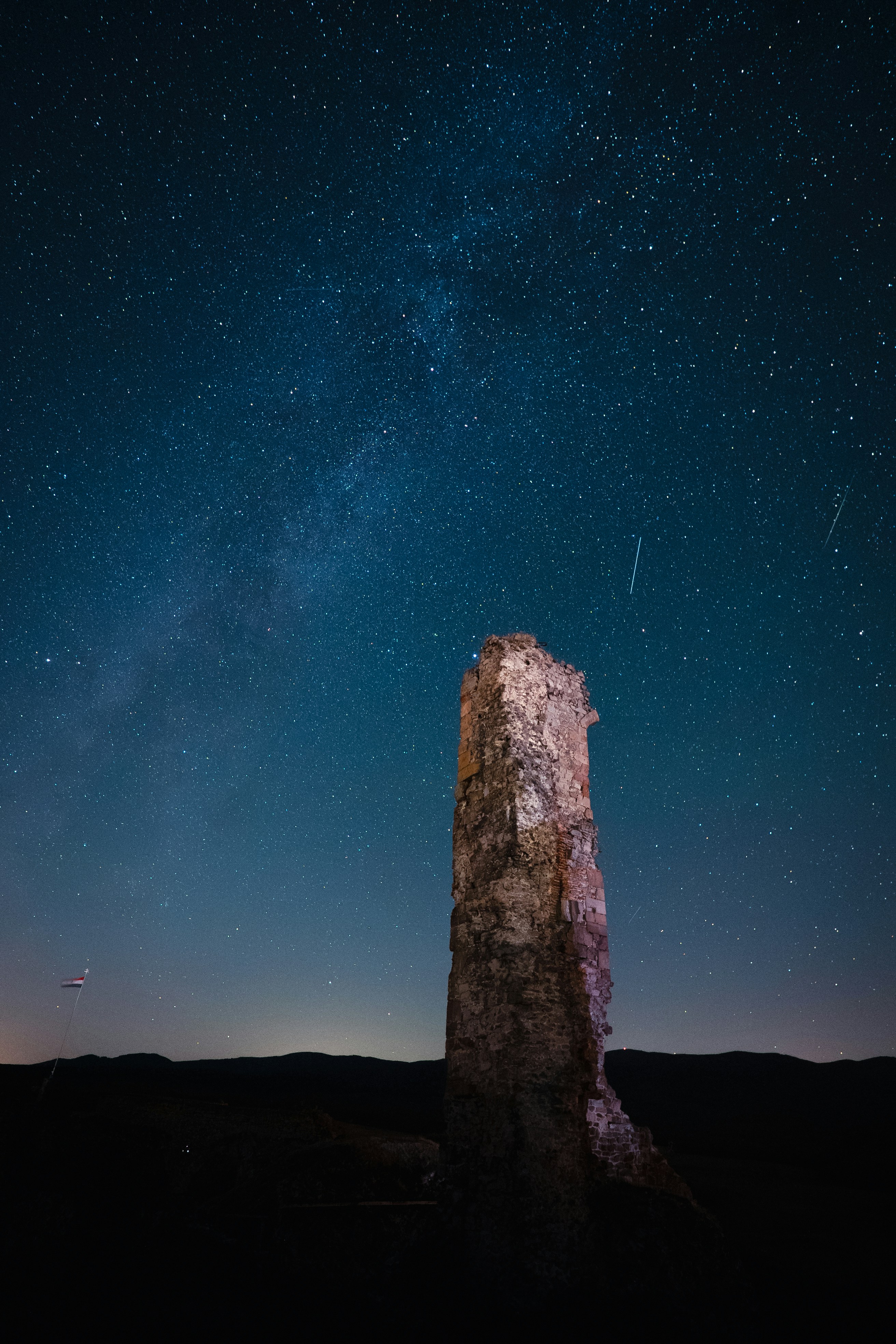 Stellar Pillar: A lone ruin under a river of stars