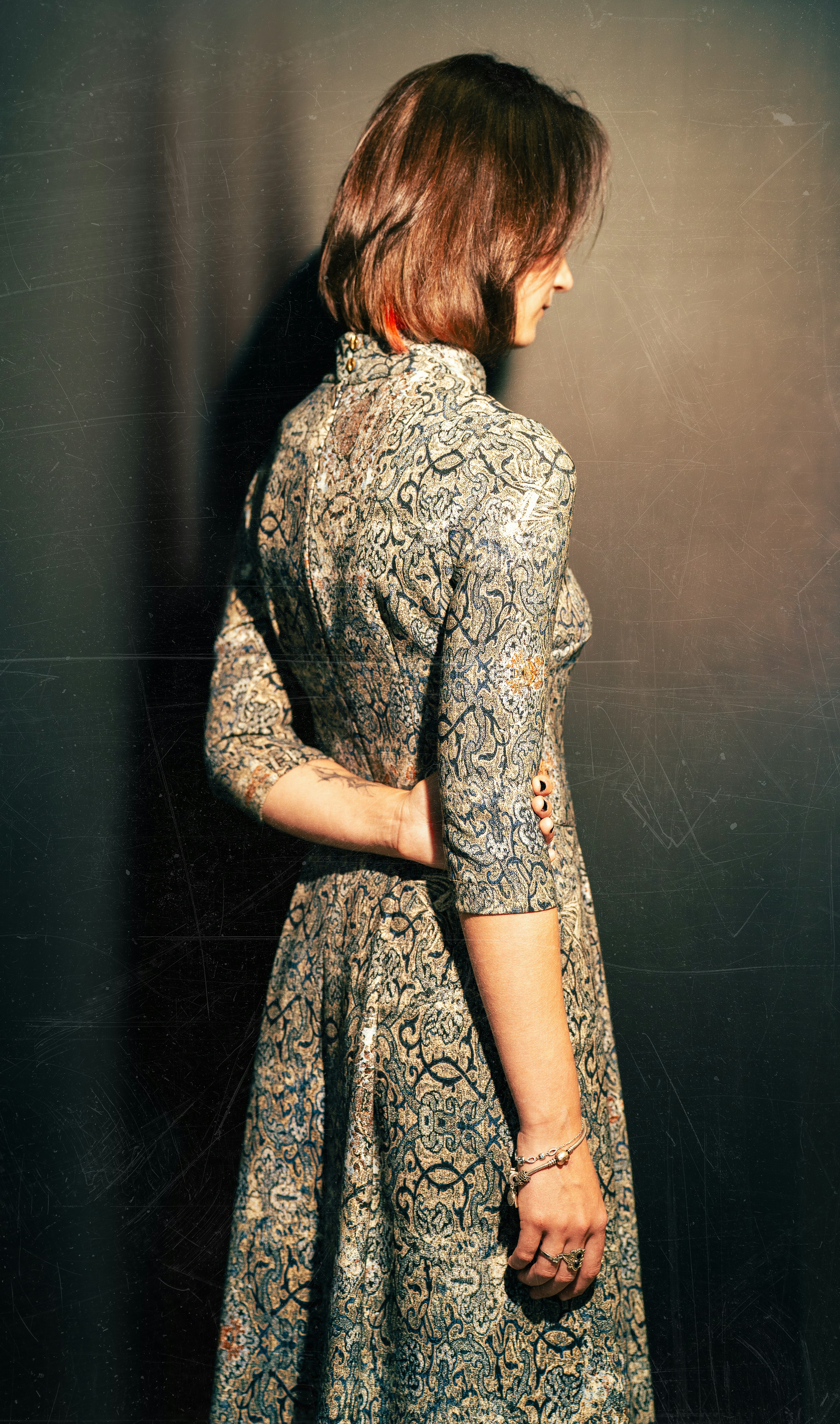 Shadowed Profile in a Velvet-Patterned Dress