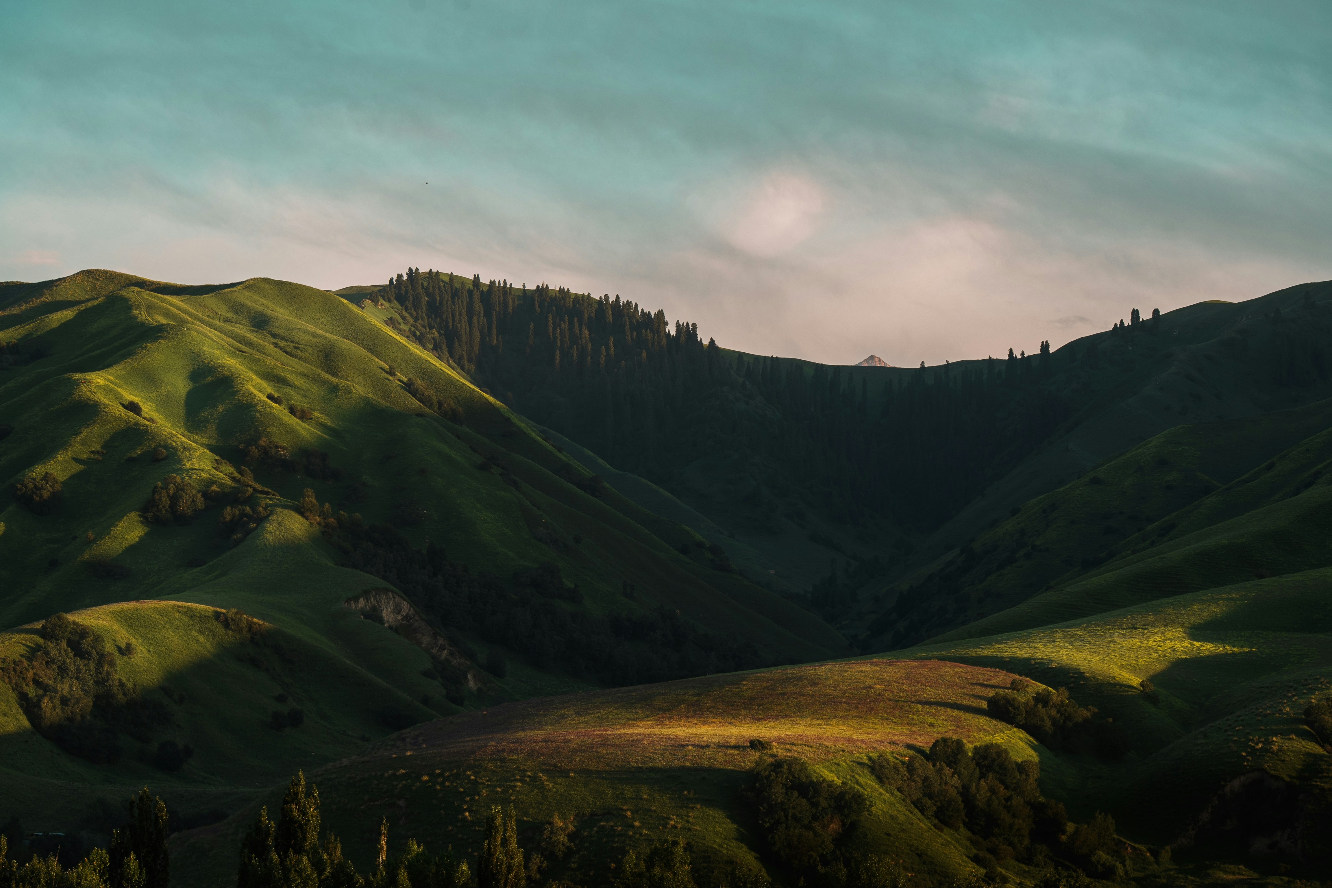 Sunlit Valleys: A Quiet Ridge Beneath a Cascading Sky
