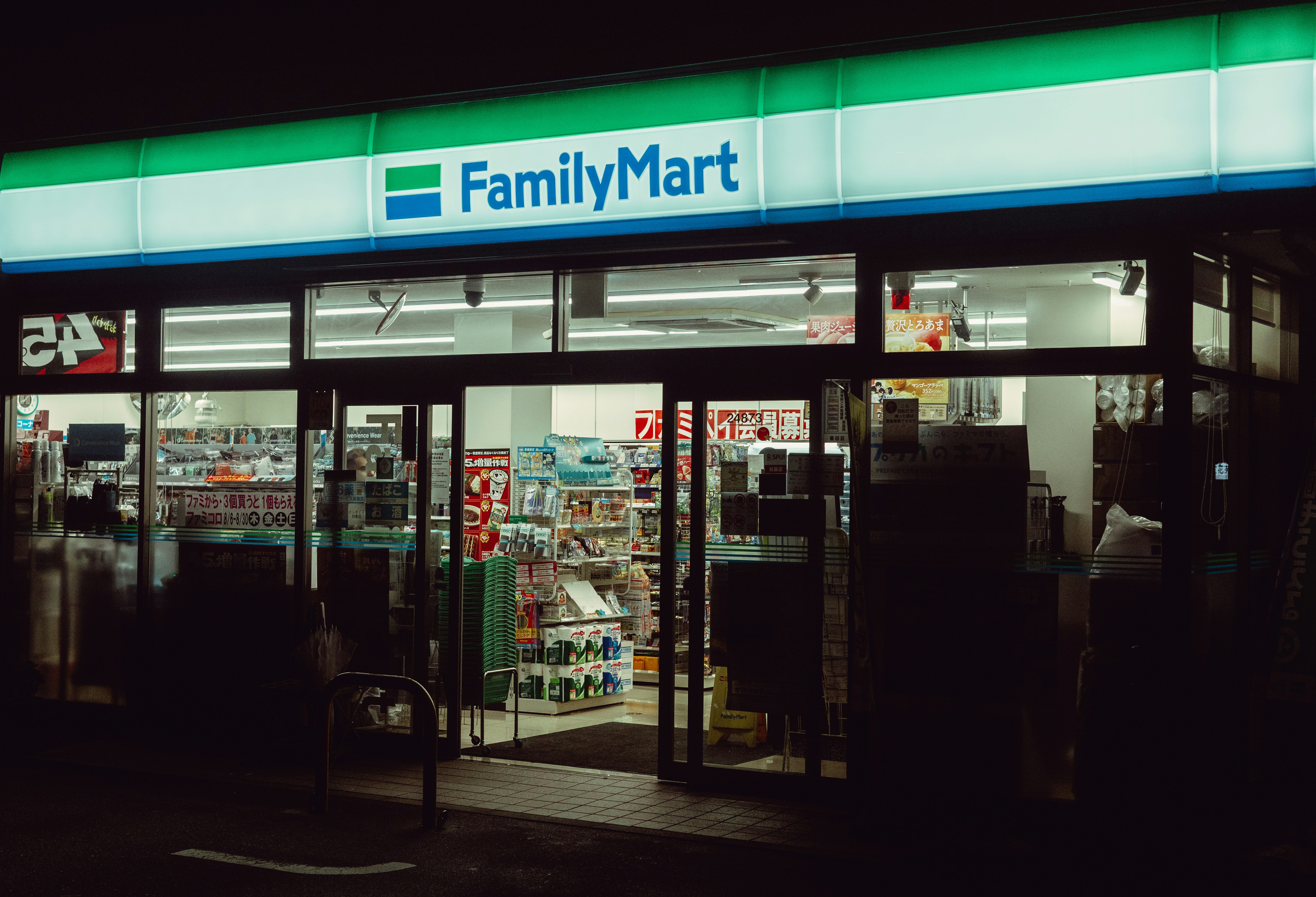 Night at the FamilyMart: A Quiet Glow Through the Glass