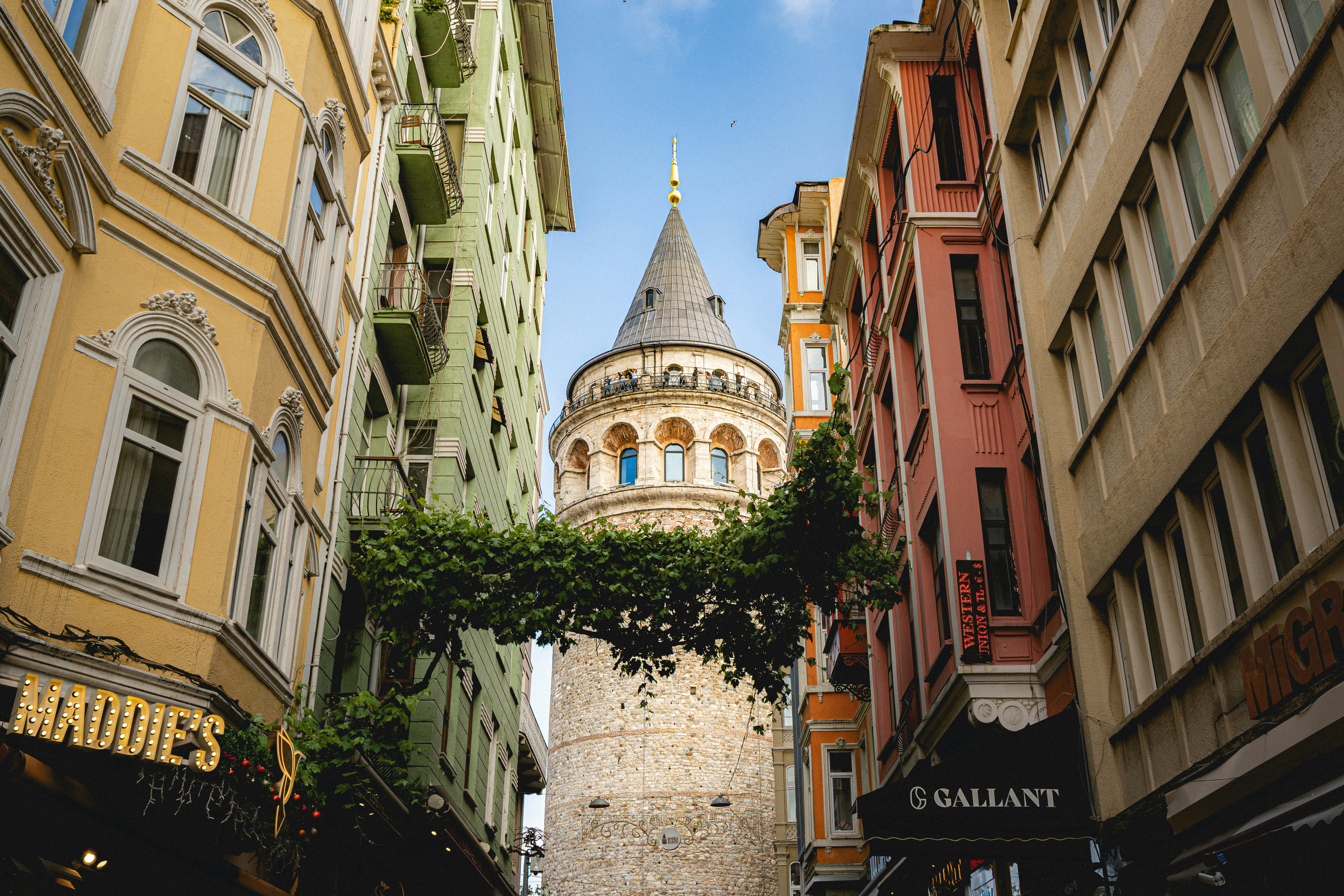 Towered Tip: The Narrow Street Leads the Eye to a Cobbled Crown