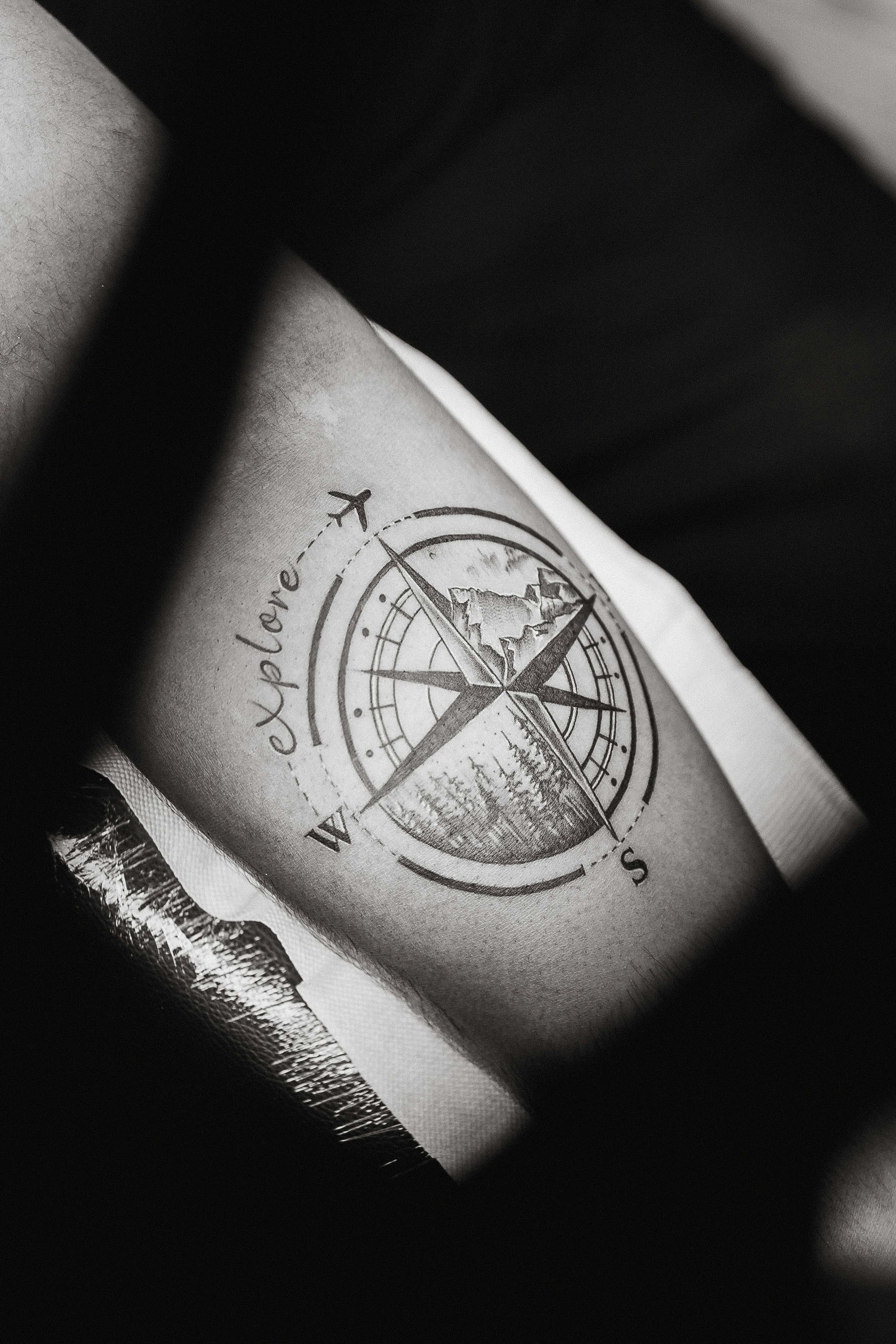 Tattoo Compass: A traveler’s mark on skin and shadow