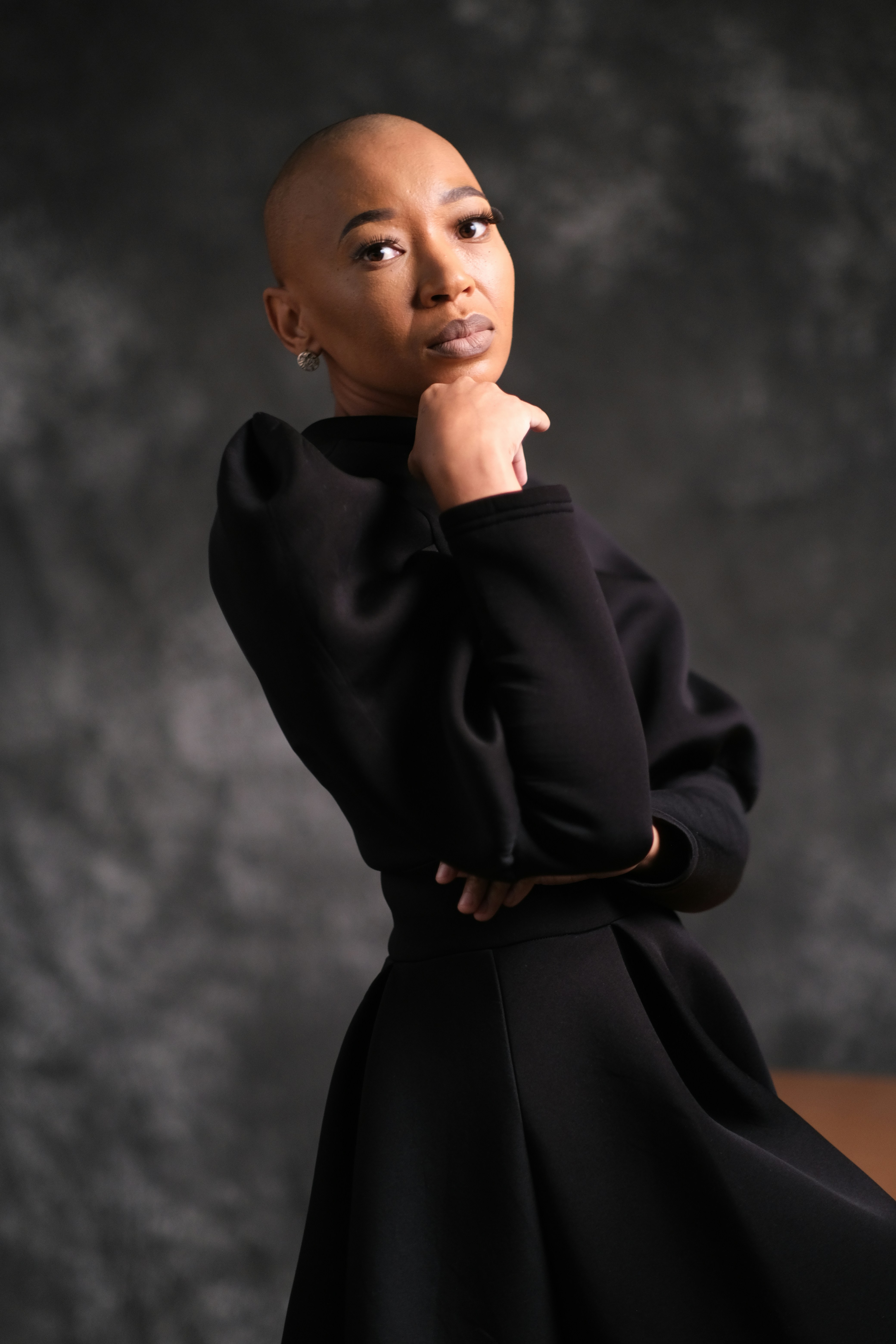 Confidence in Focus: A Poised Portrait in Velvet Black