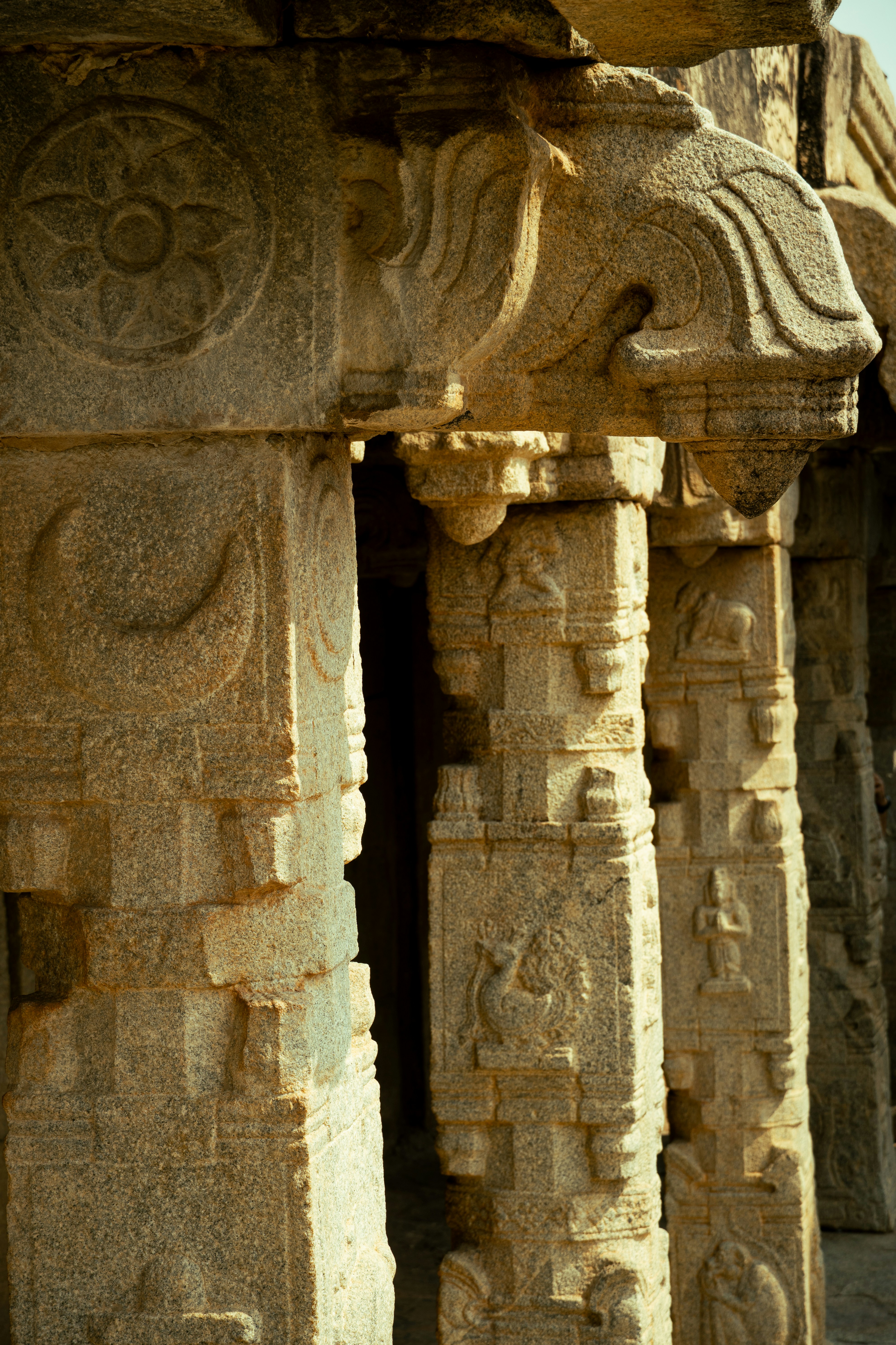 Stone Carvings in a Dim Temple Corridor