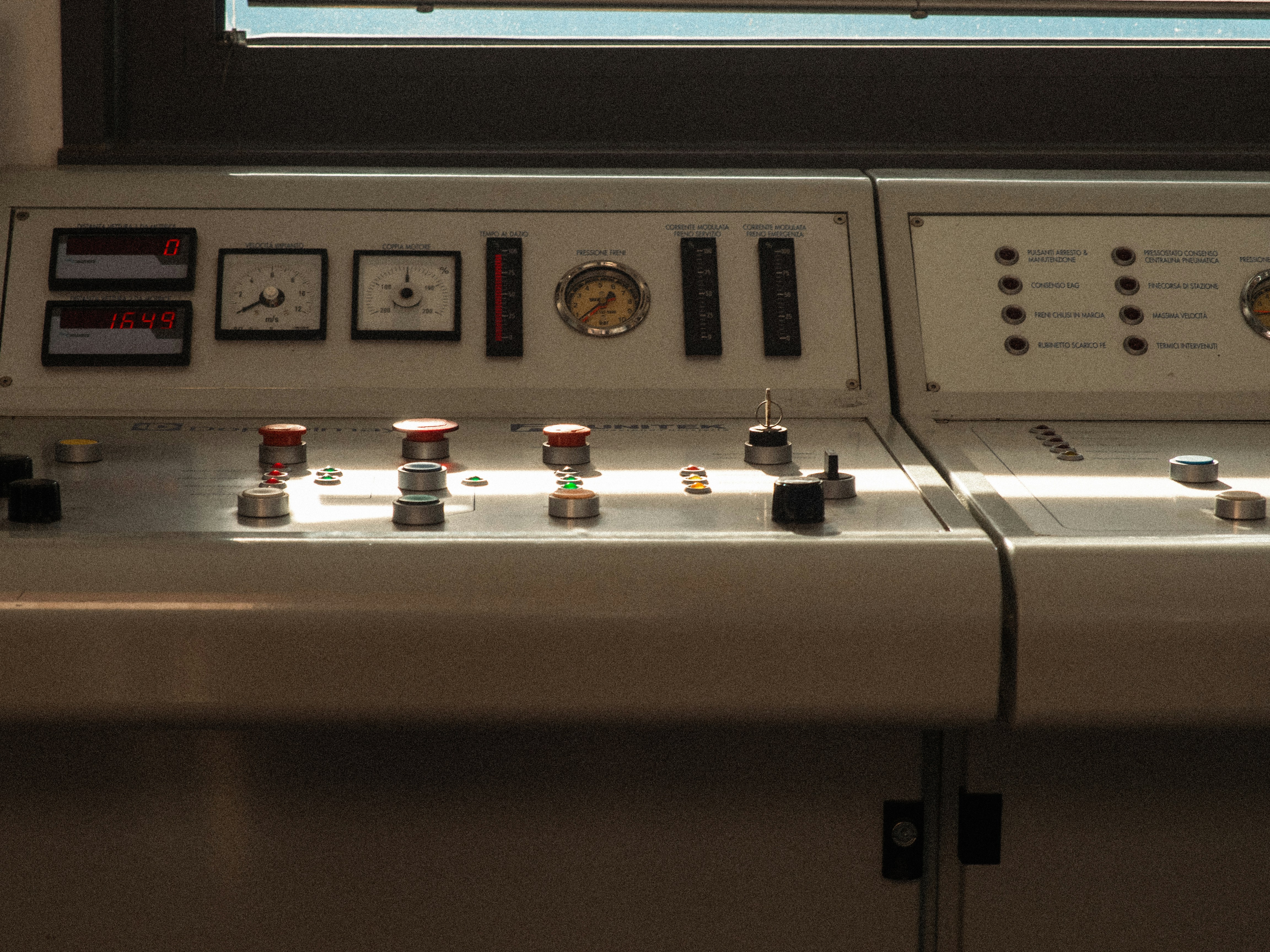 Industrial Control Panel: Dials and Push Buttons in a Faded Studio Setting