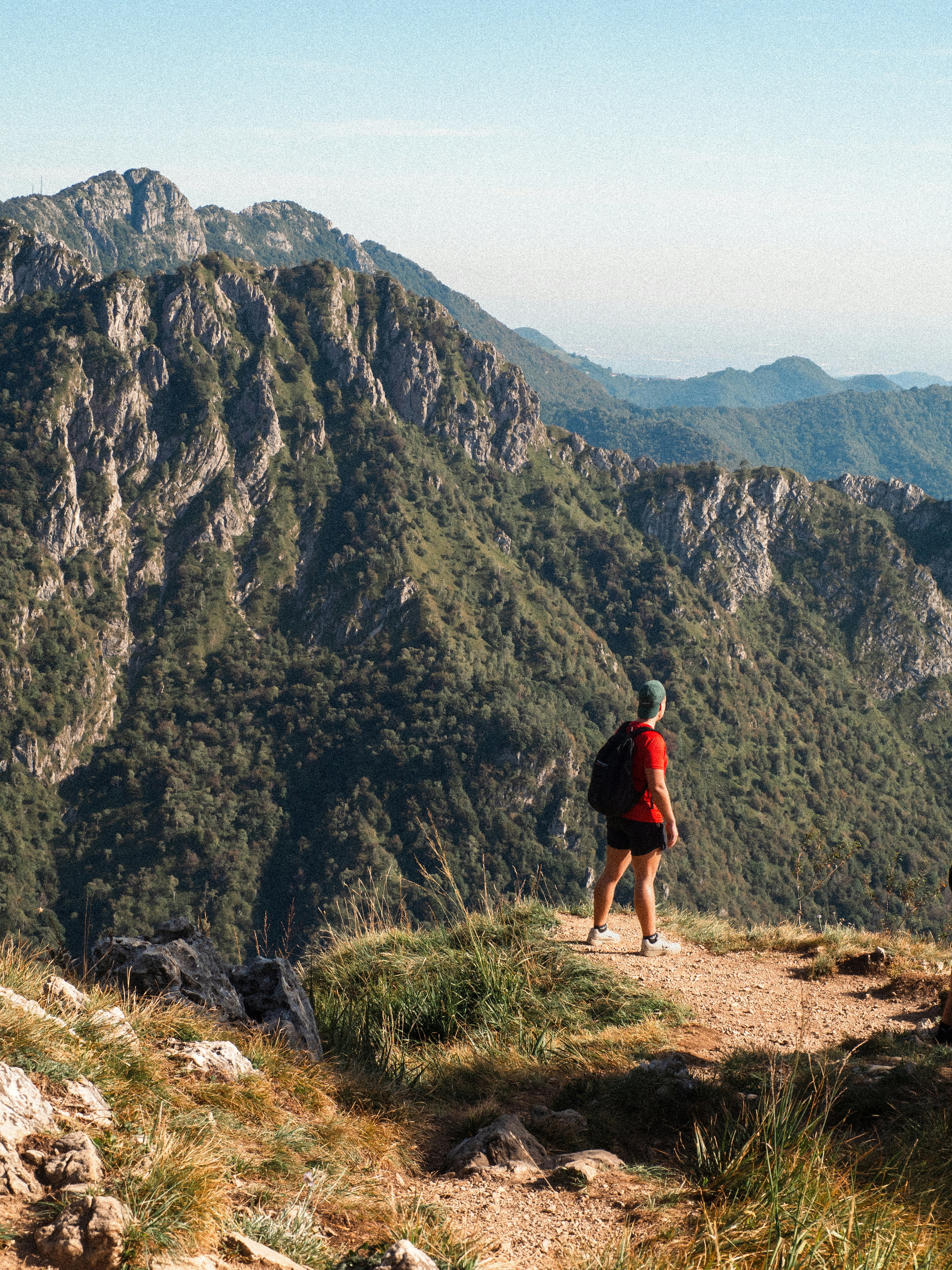 Hiker at the Edge: A Mountain Vista Expedition
