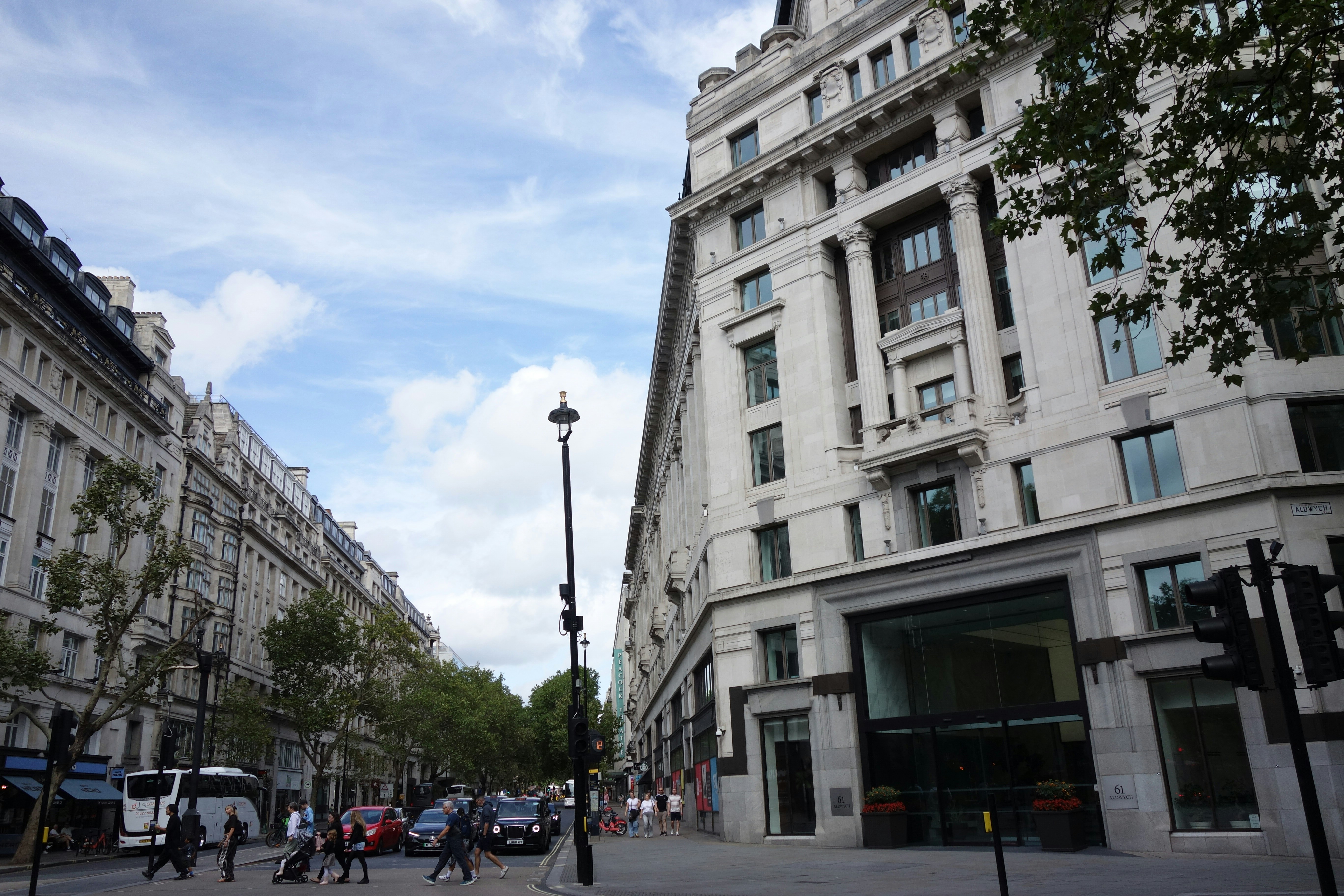 City Street Confluence Under a Limestone Facade