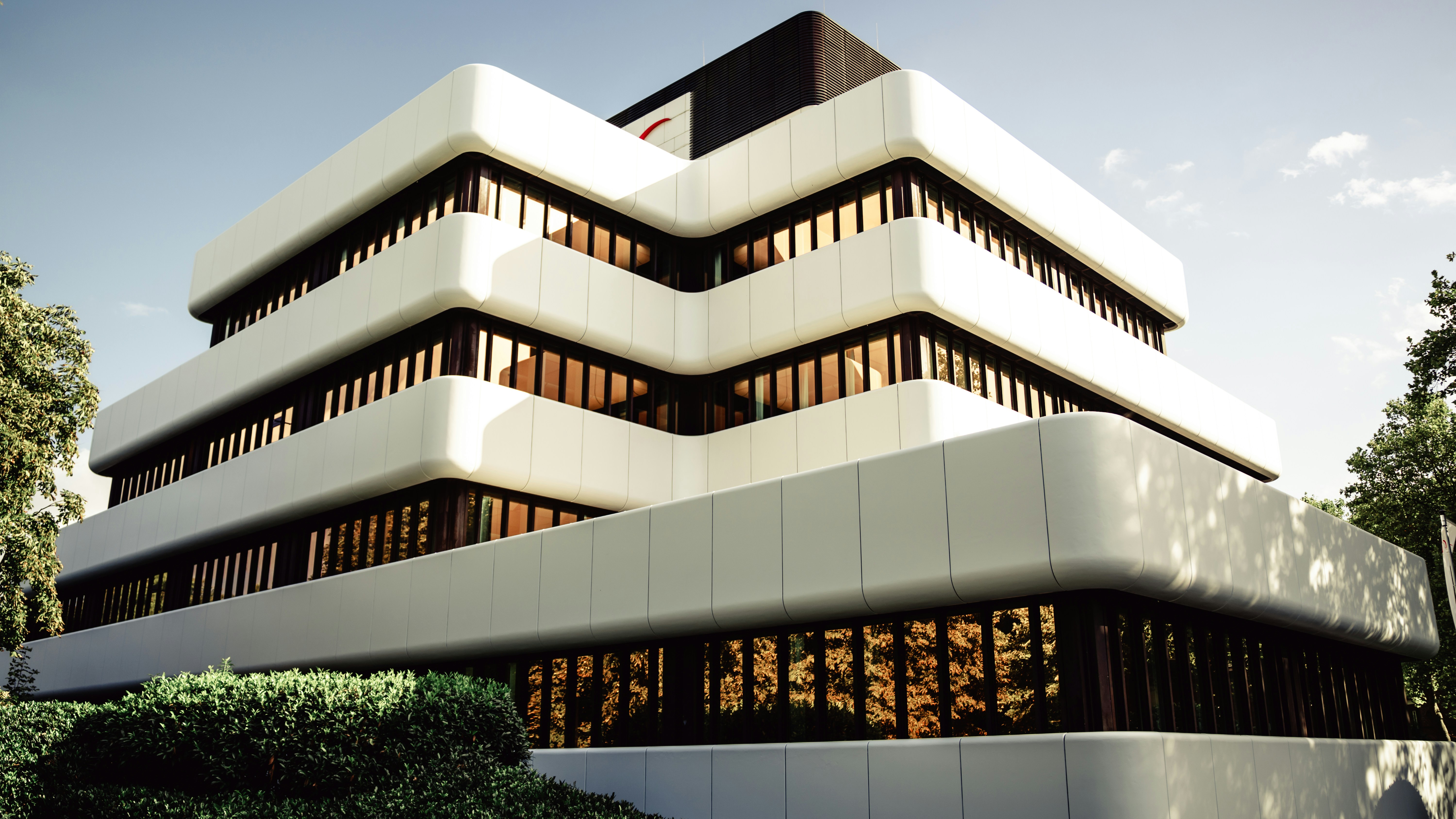 Curved Horizons: The Segmented White Structure Rising Above Shadowed Ground