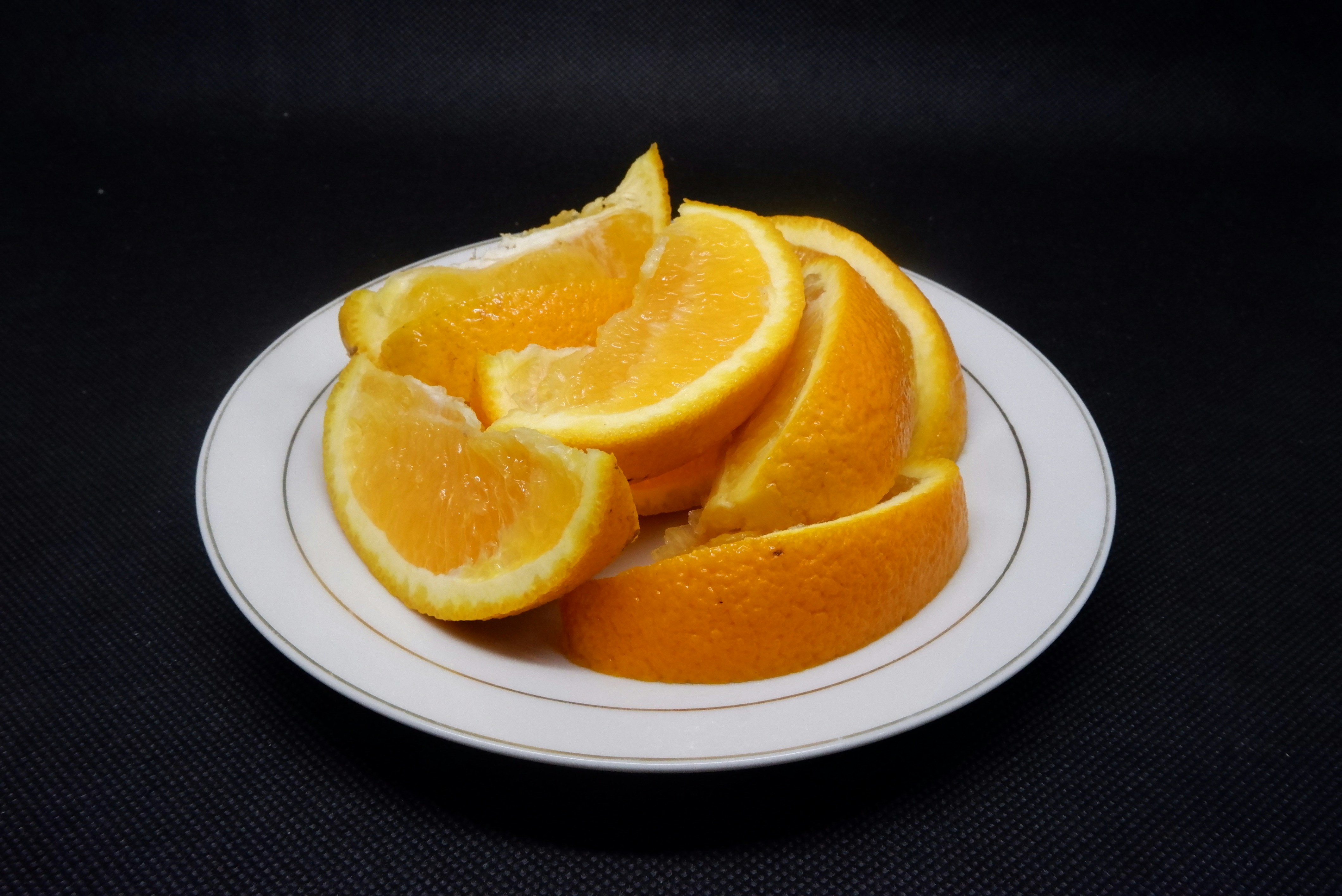 Citrus Circle: Orange Wedges on a Minimal Plate