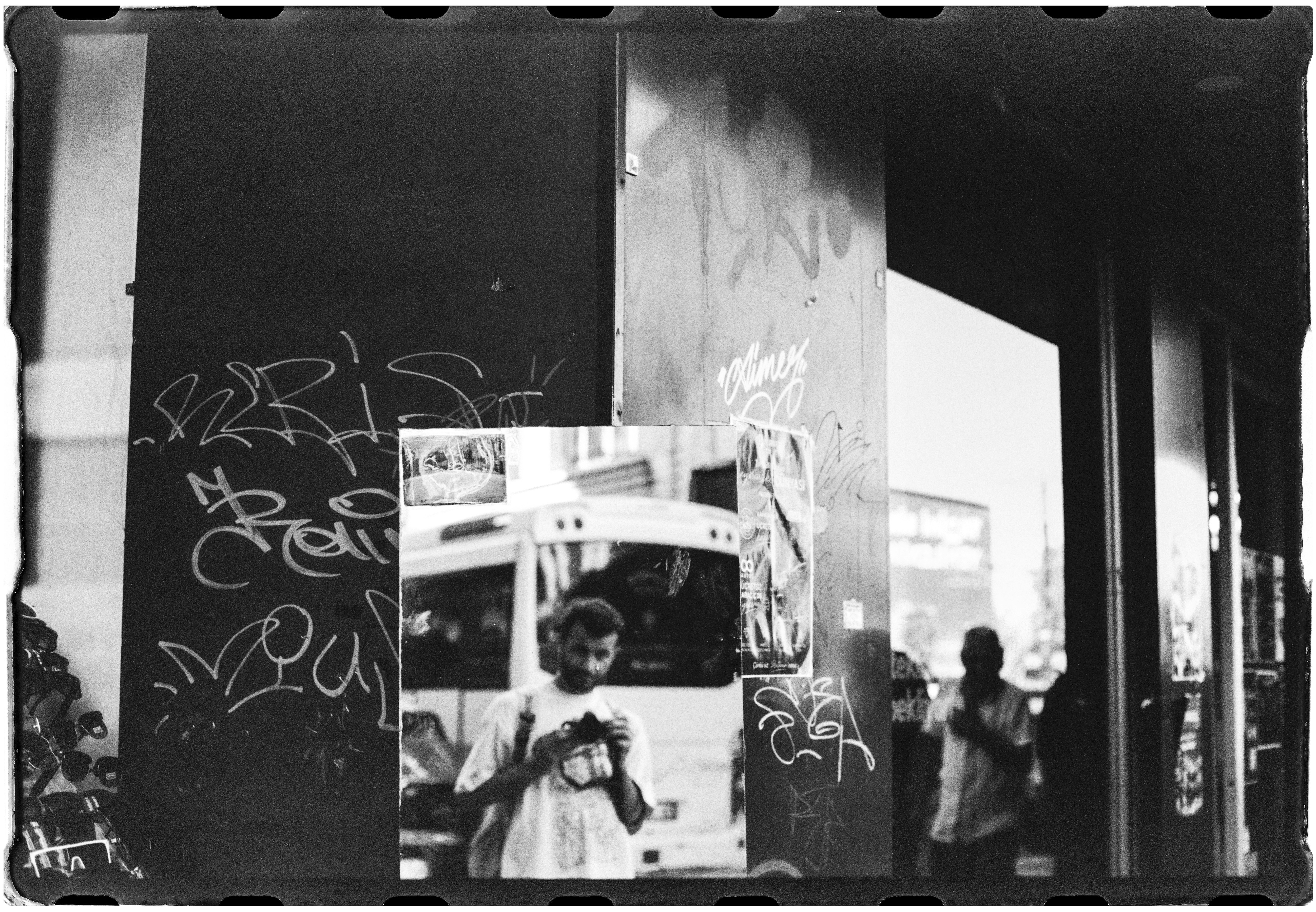 Graffiti Alley Reflections: A Street Portrait Within a Mirrored Moment