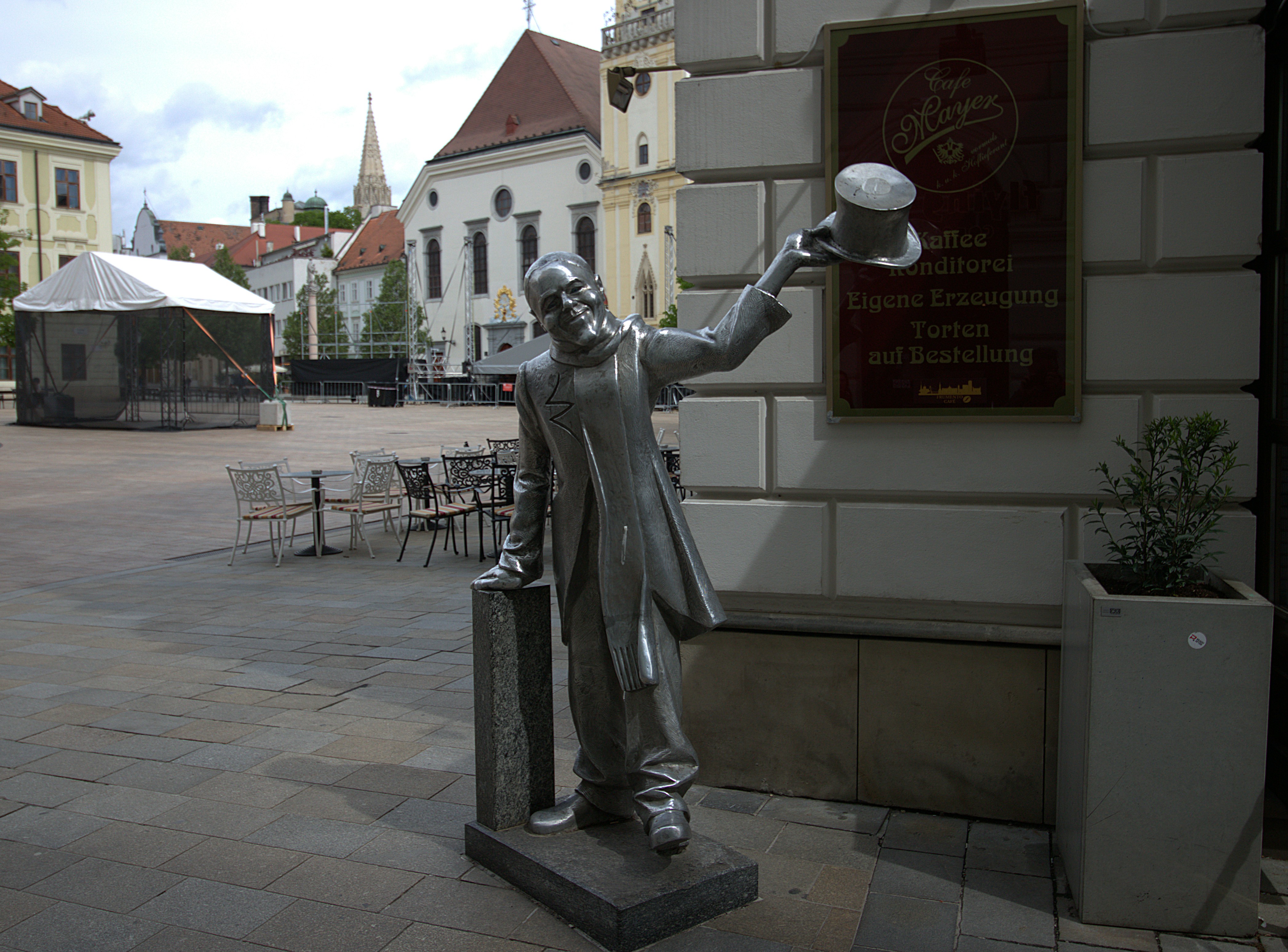 Statue Maestro of the Square: A Dapper Salute in Cobblestone Alley