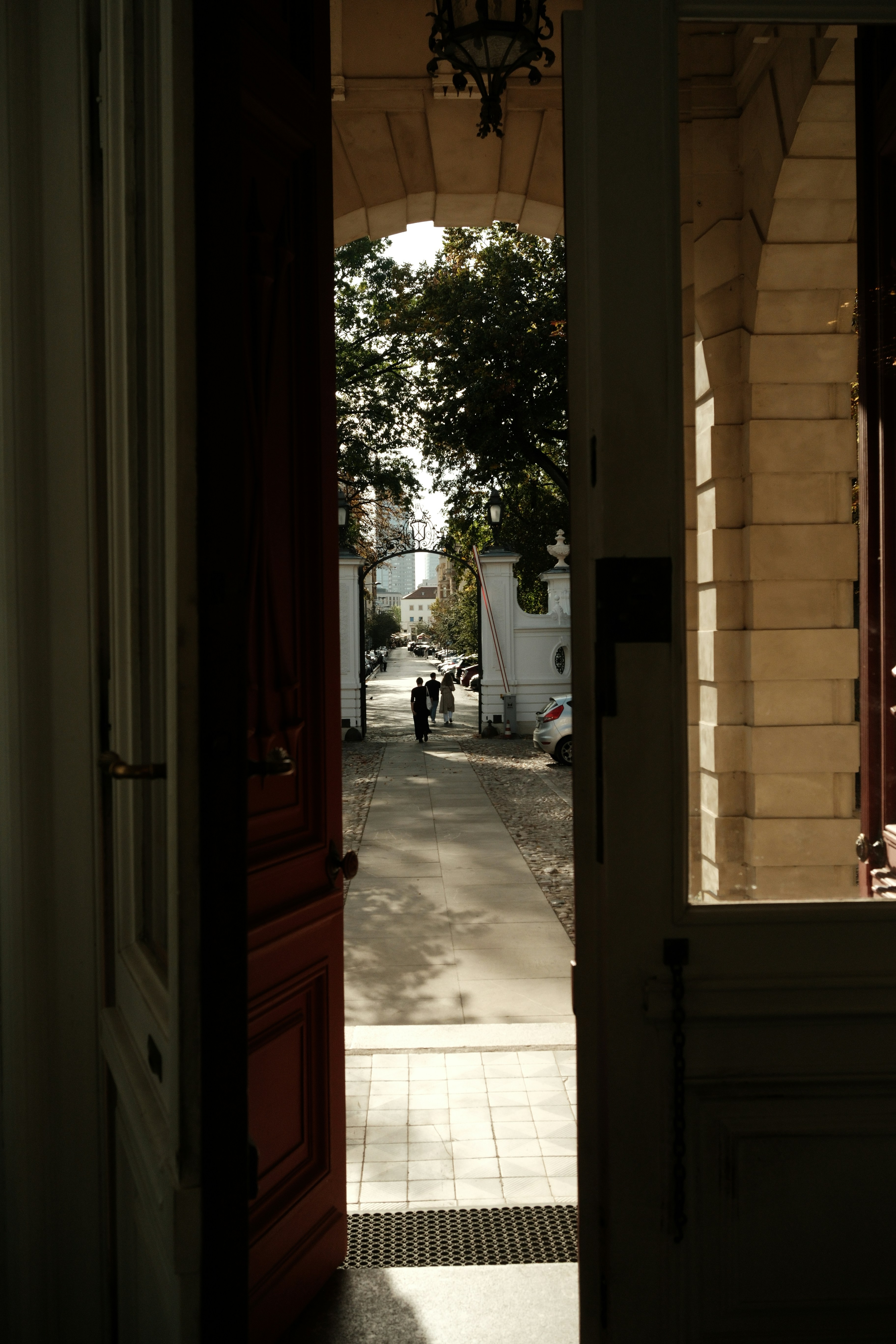 Glimpse Down a Sunlit Paved Avenue