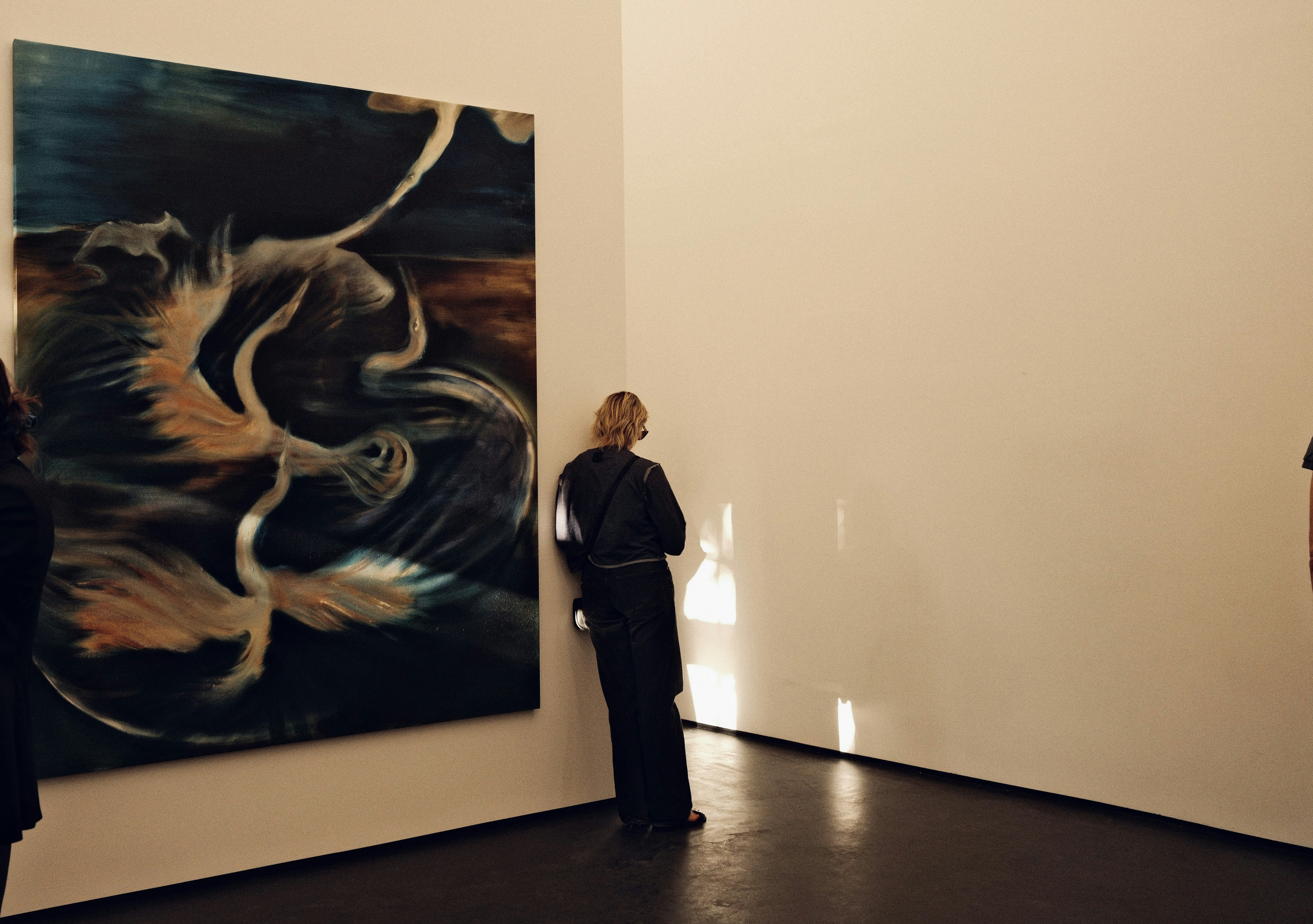 Figures at the Edge of a Swirling Canvas
