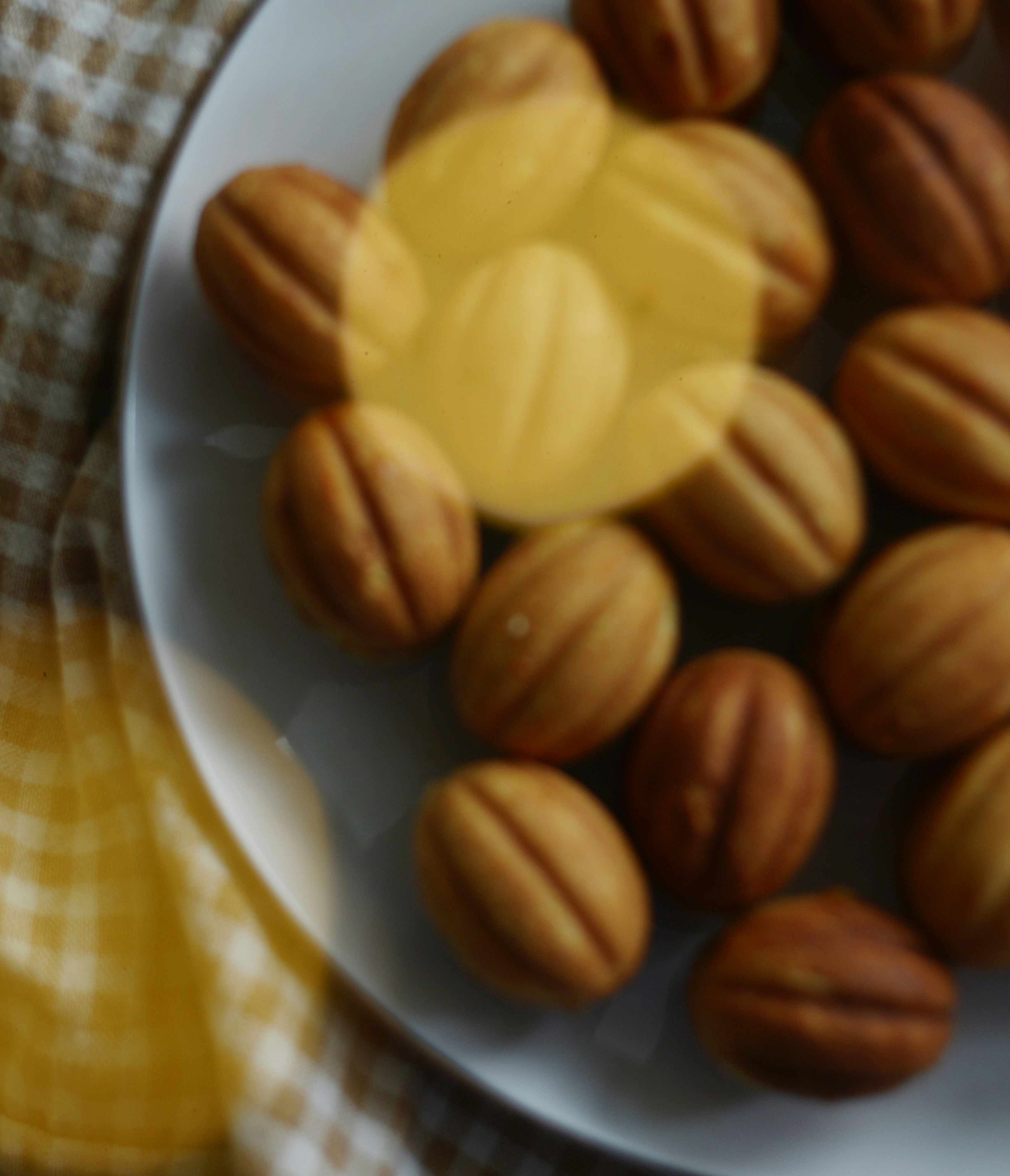 Golden Orb Delicacy: A Plate of Nuts with Warm Glaze