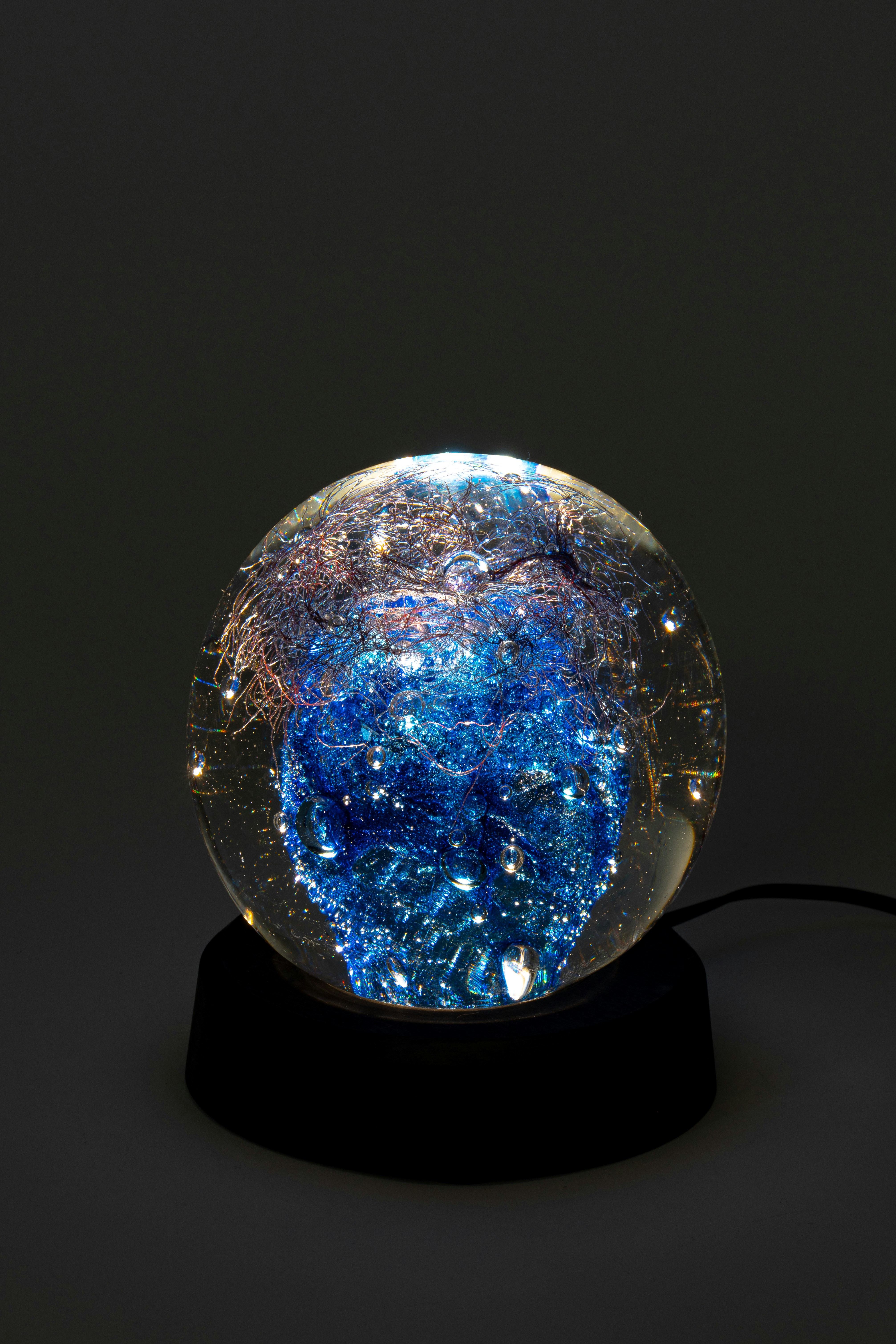 Glowing Orb: A Crystalline Portrait in Blue