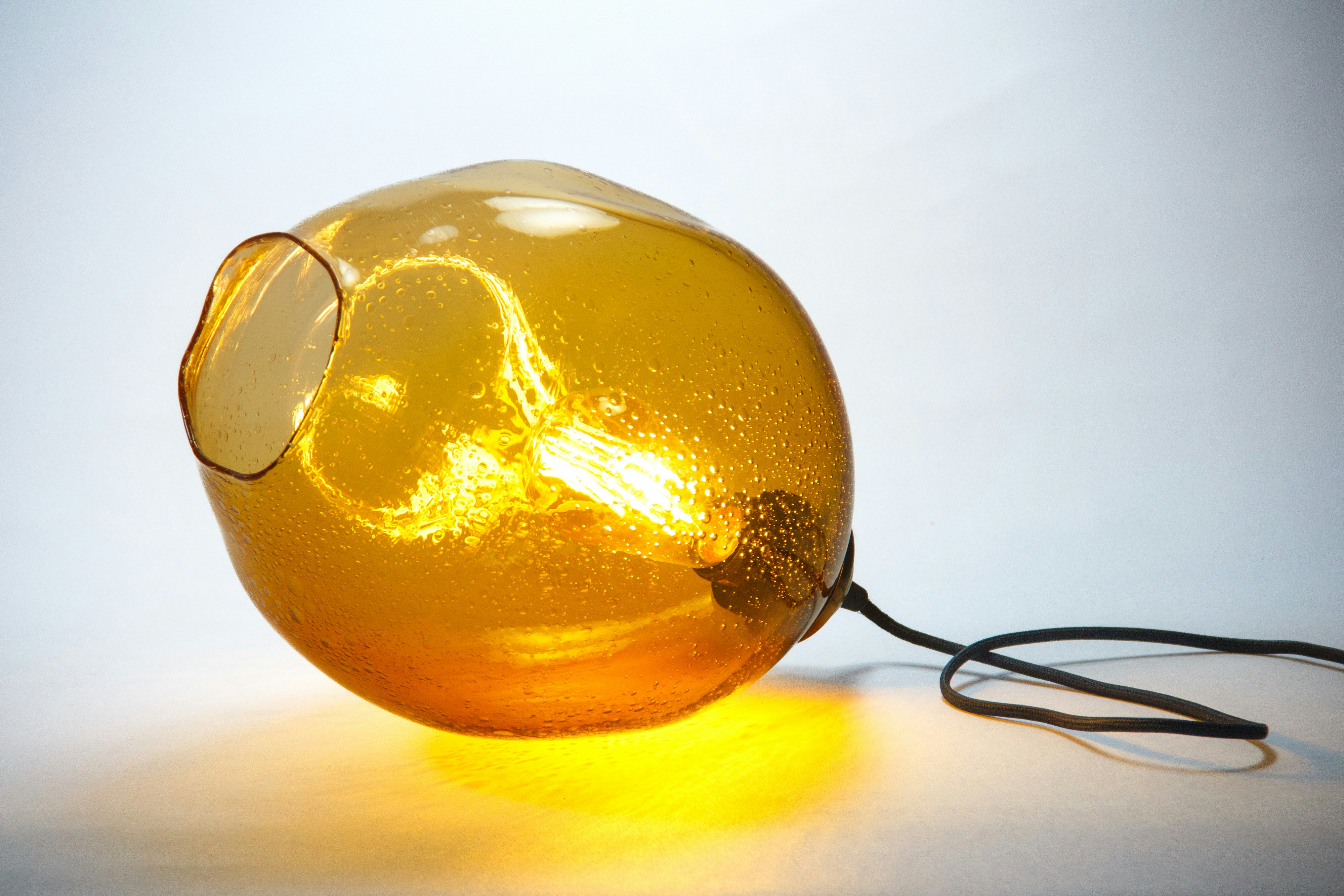 Golden Glass Globe on a Warm Studio Glow