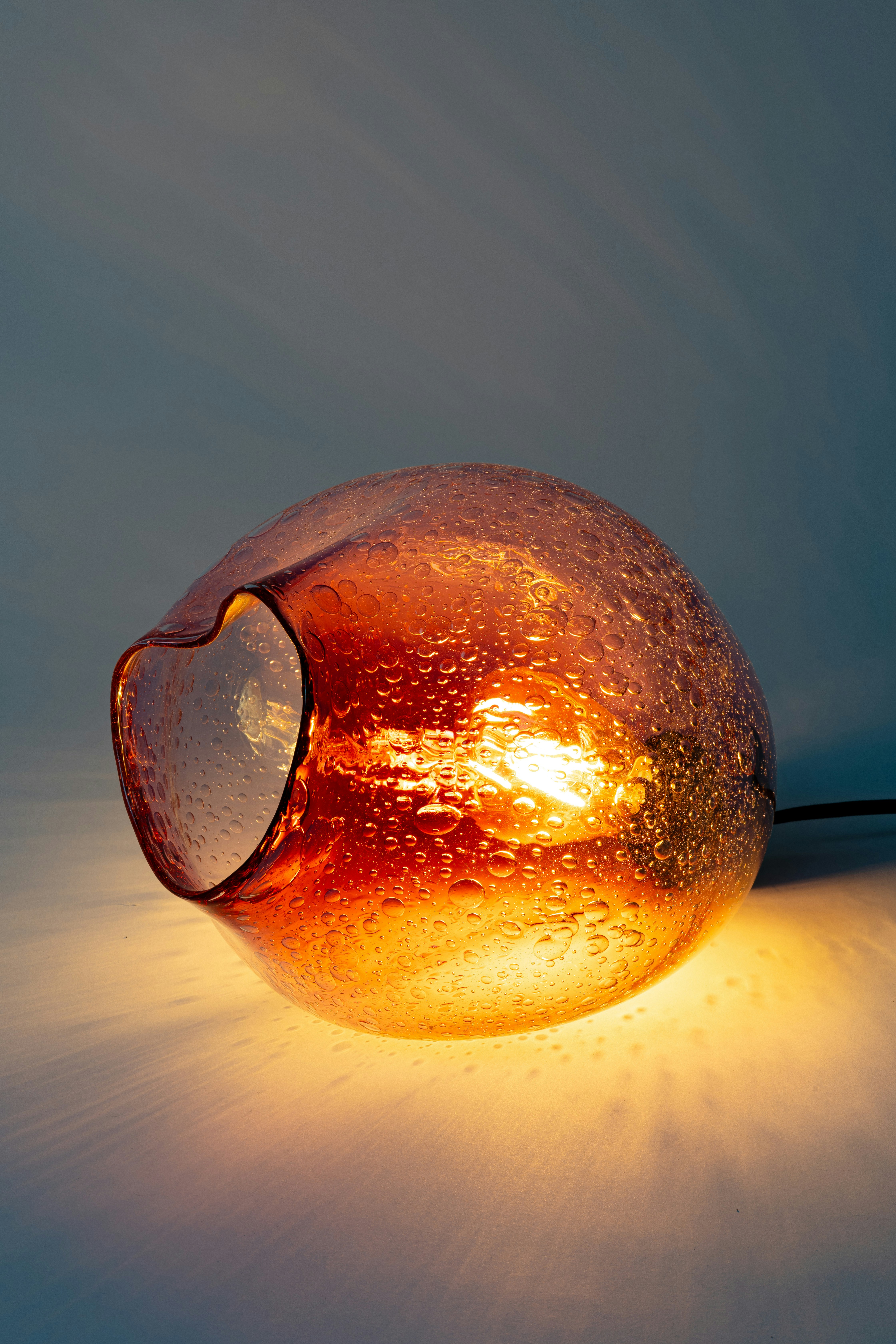 Glowing Orb: A Dew-Speckled Glass Lamp