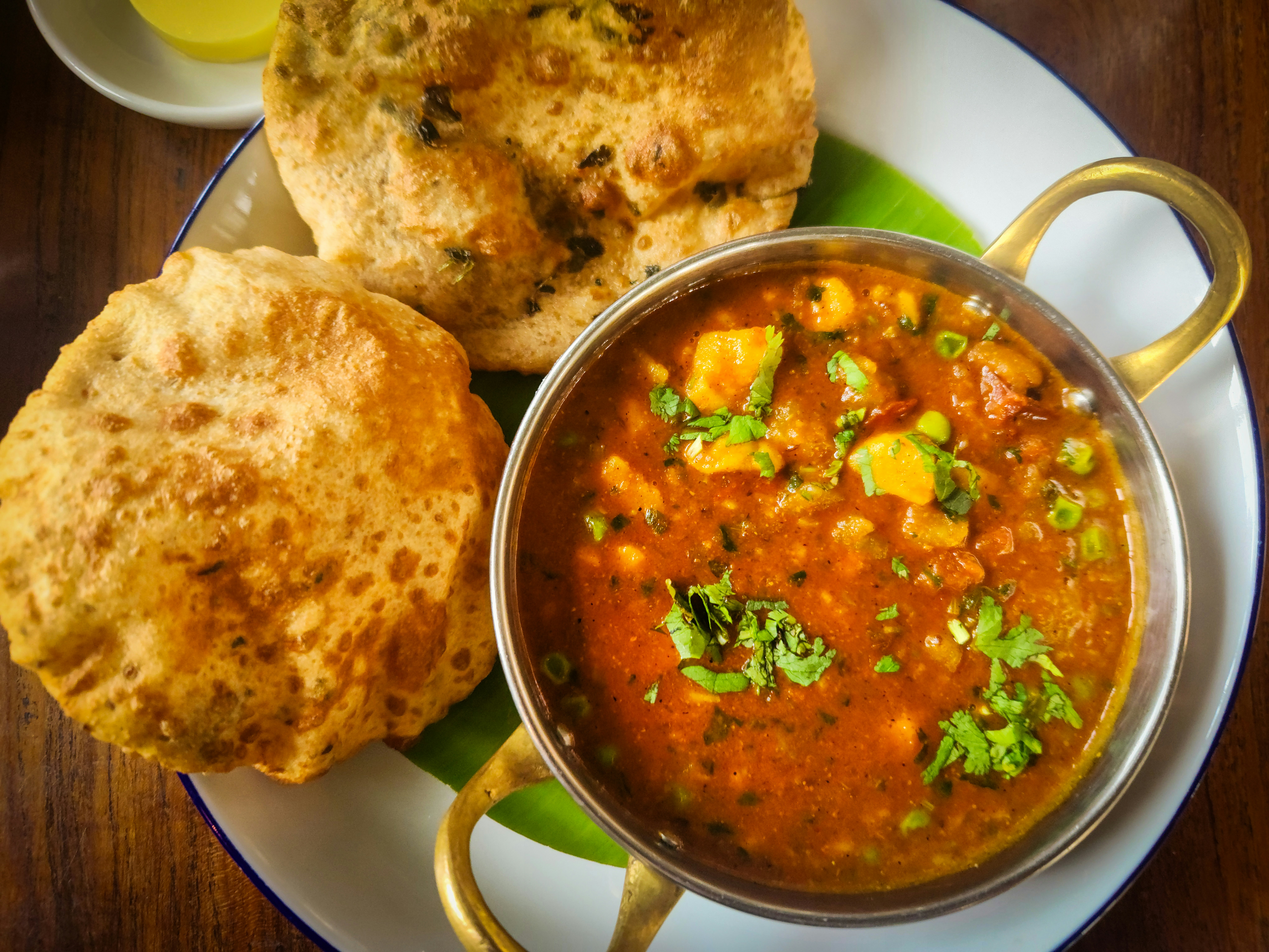 Spiced curry and fluffy naan on a shared platter