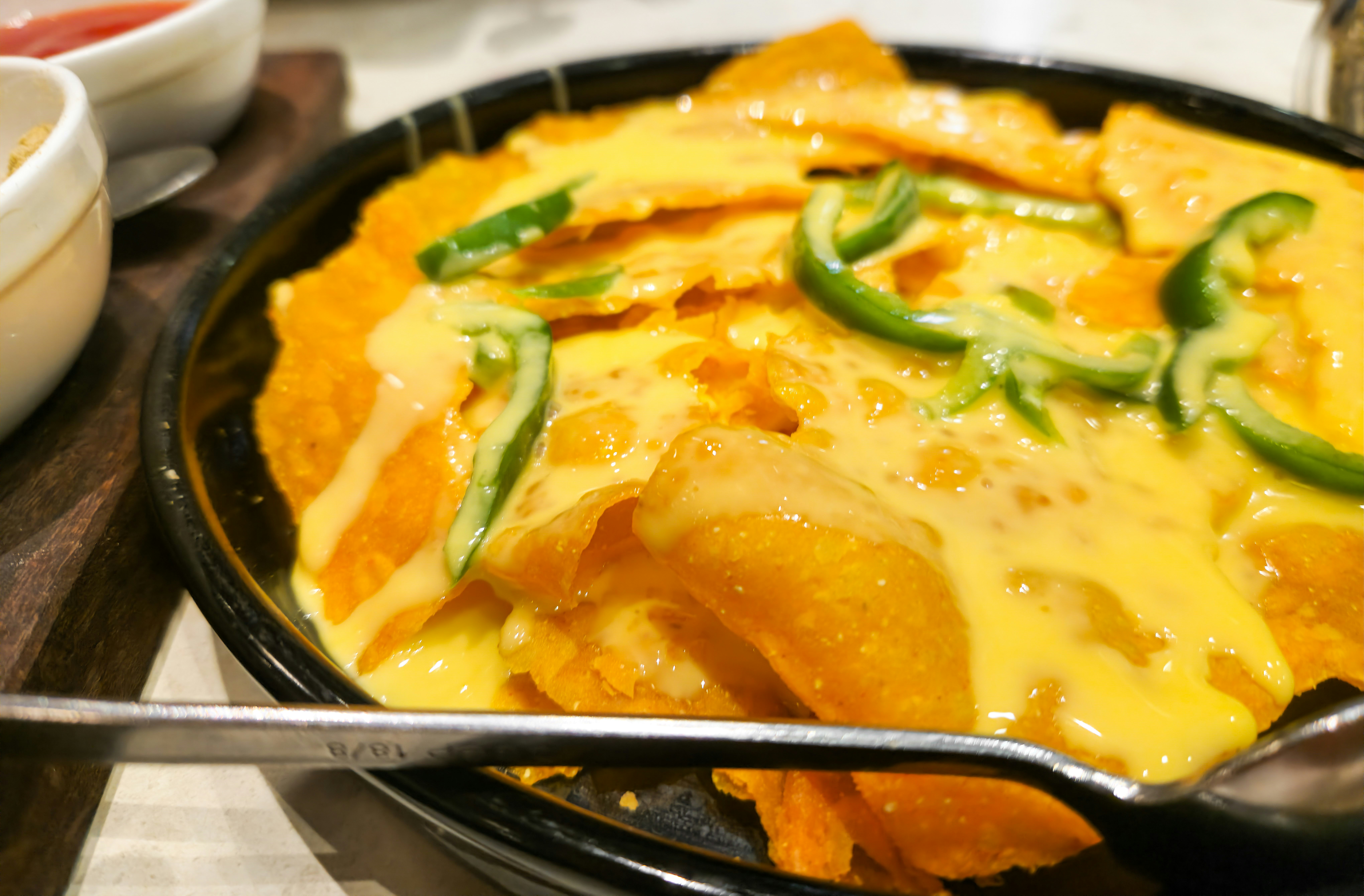 Creamy Nachos in a Crispy Cheese Crown with Jalapeño Garnish