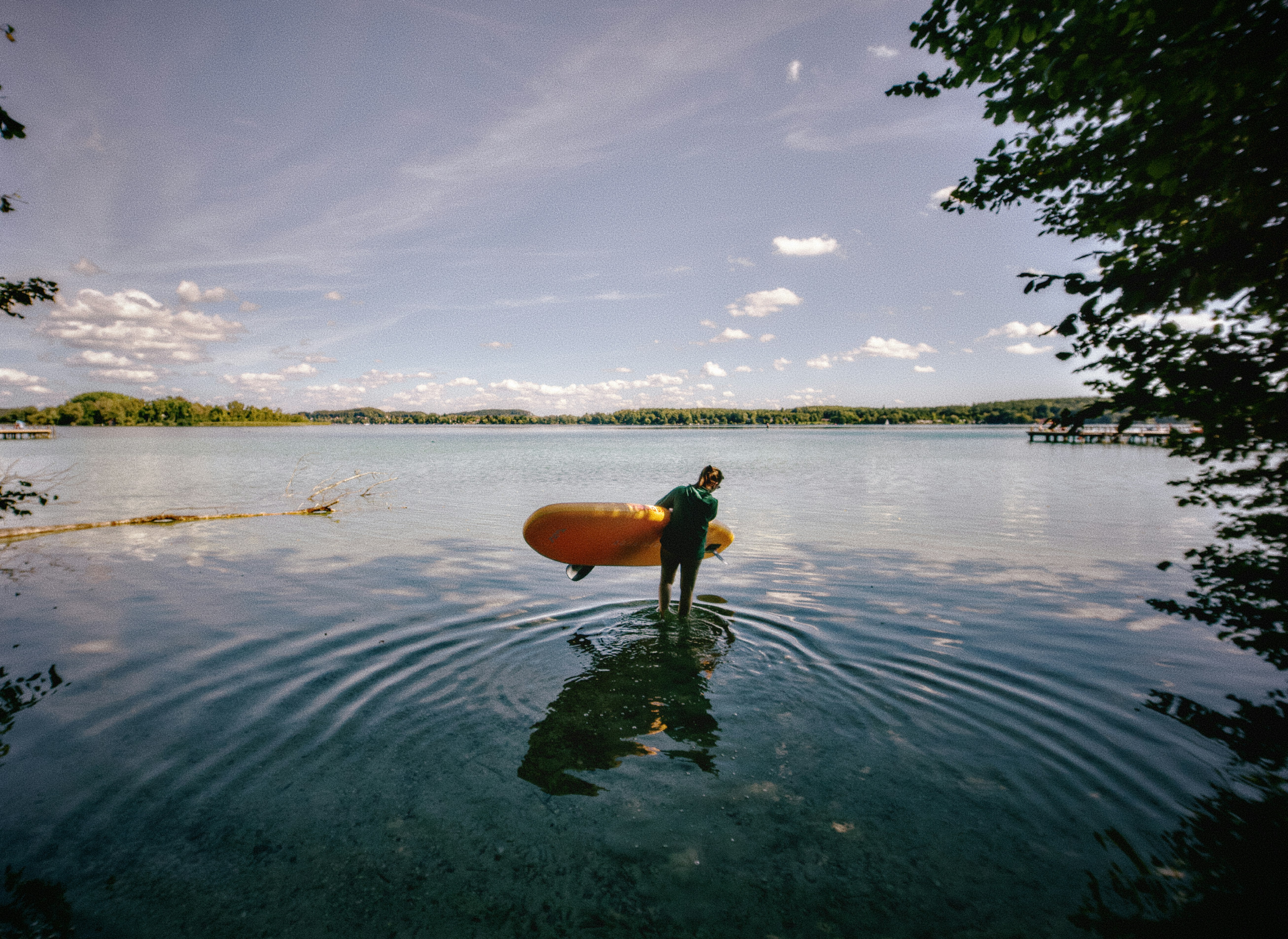 Solitary Surfer at the Riverside Edge