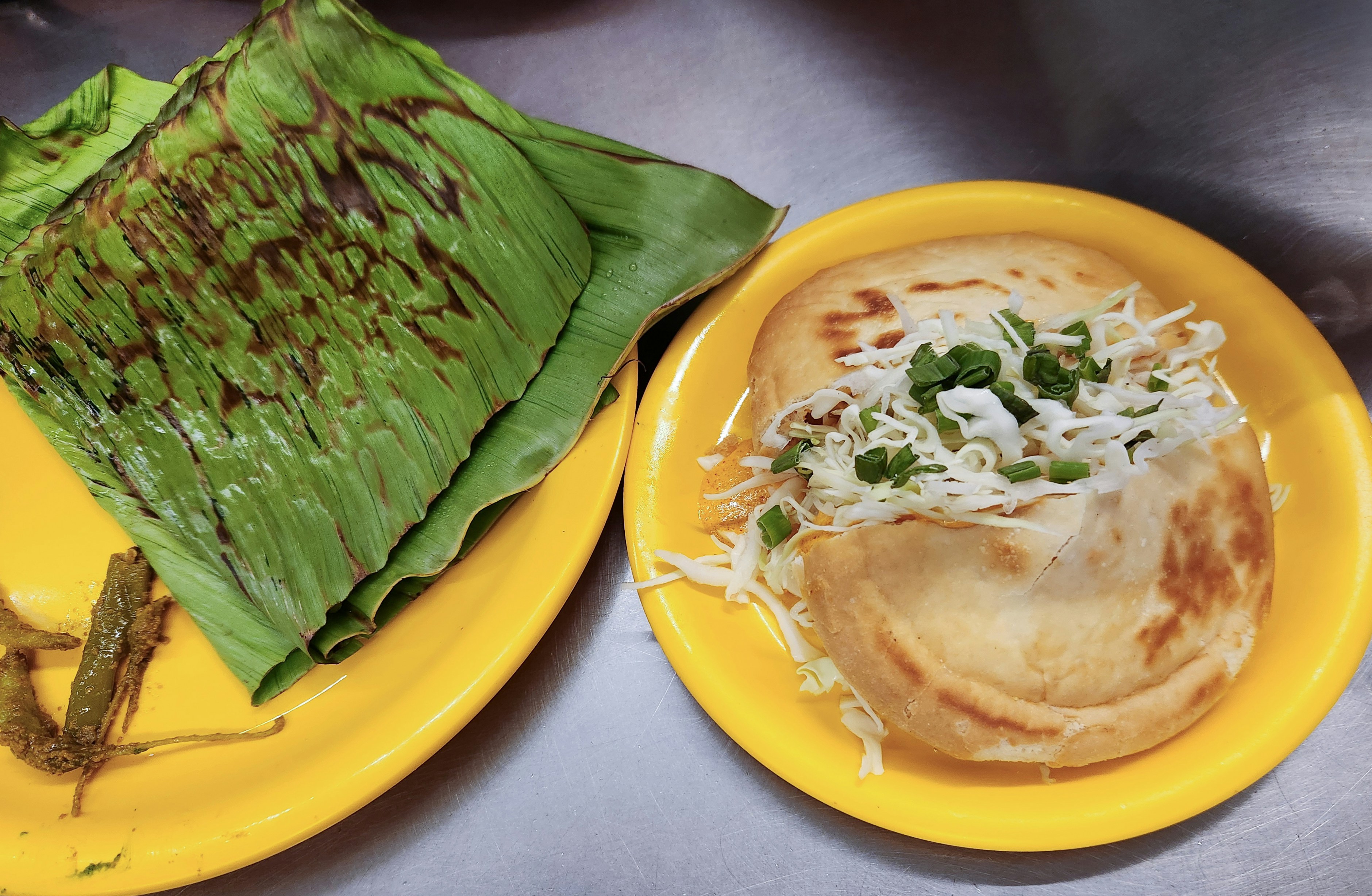 Golden Circle: Charred Banana Leaf and Plate of Stuffed Bread