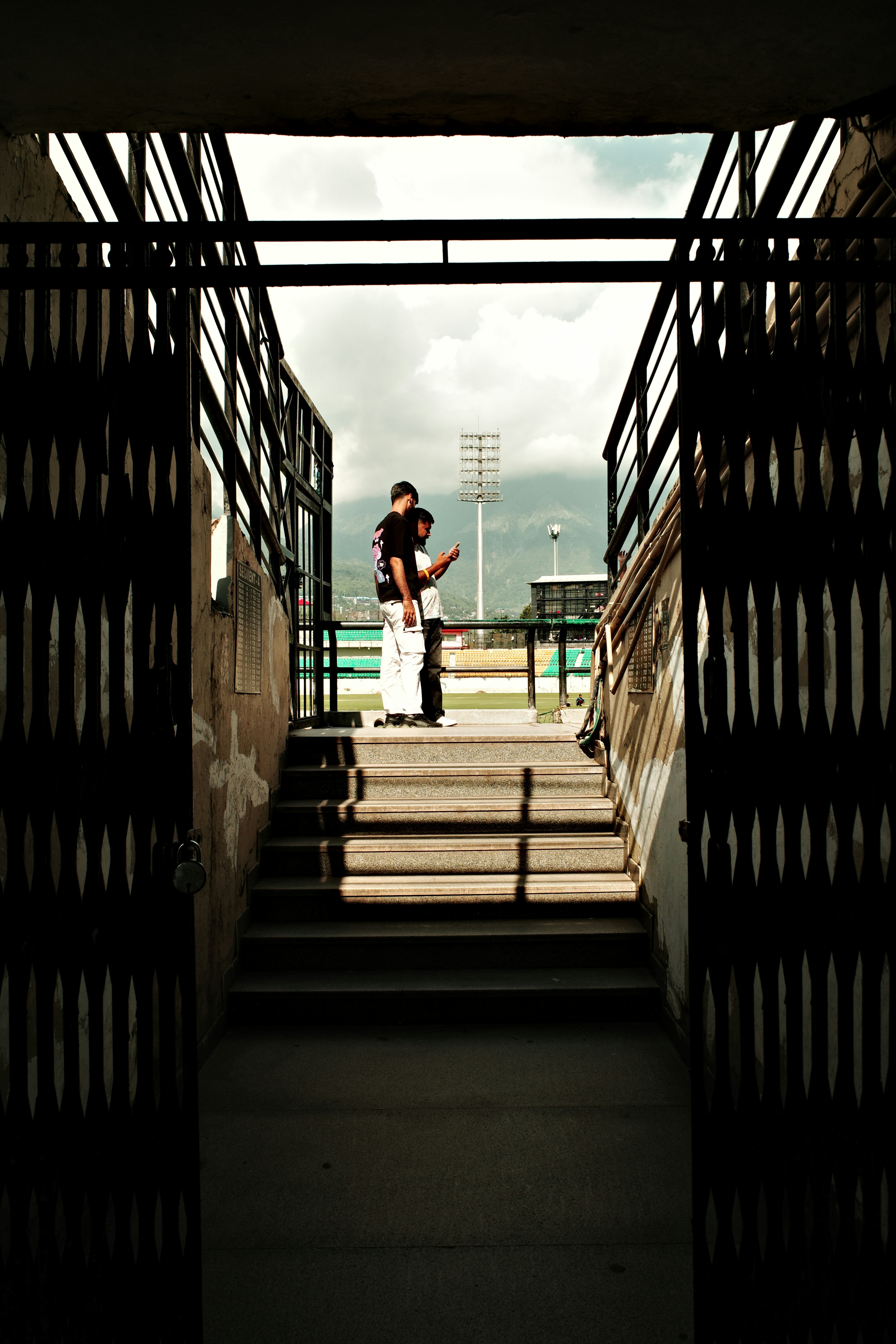 Stadium Shadows: a Quiet Moment at the Gate